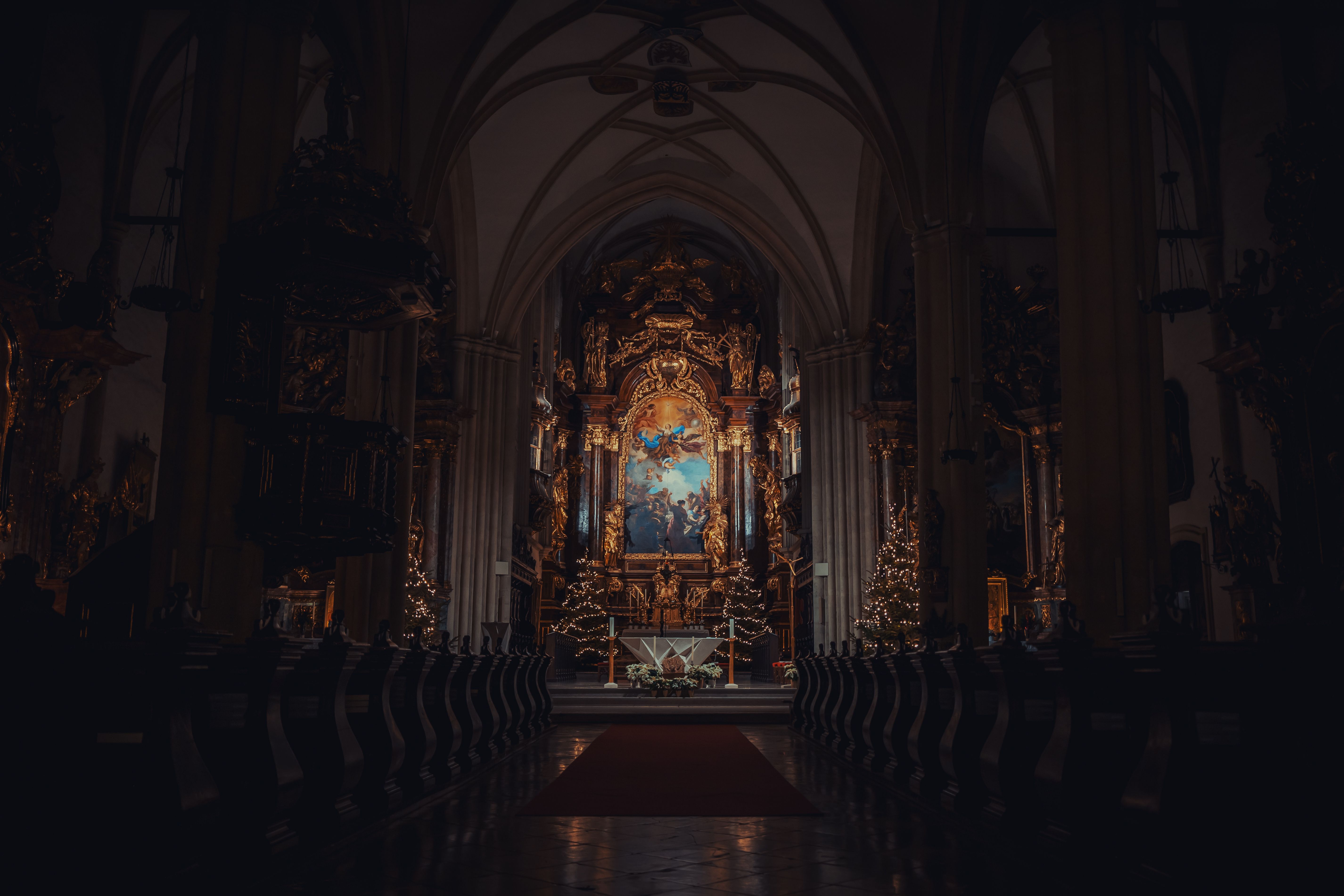 Ornate Cathedral Altar in Dim Lighting · Free Stock Photo
