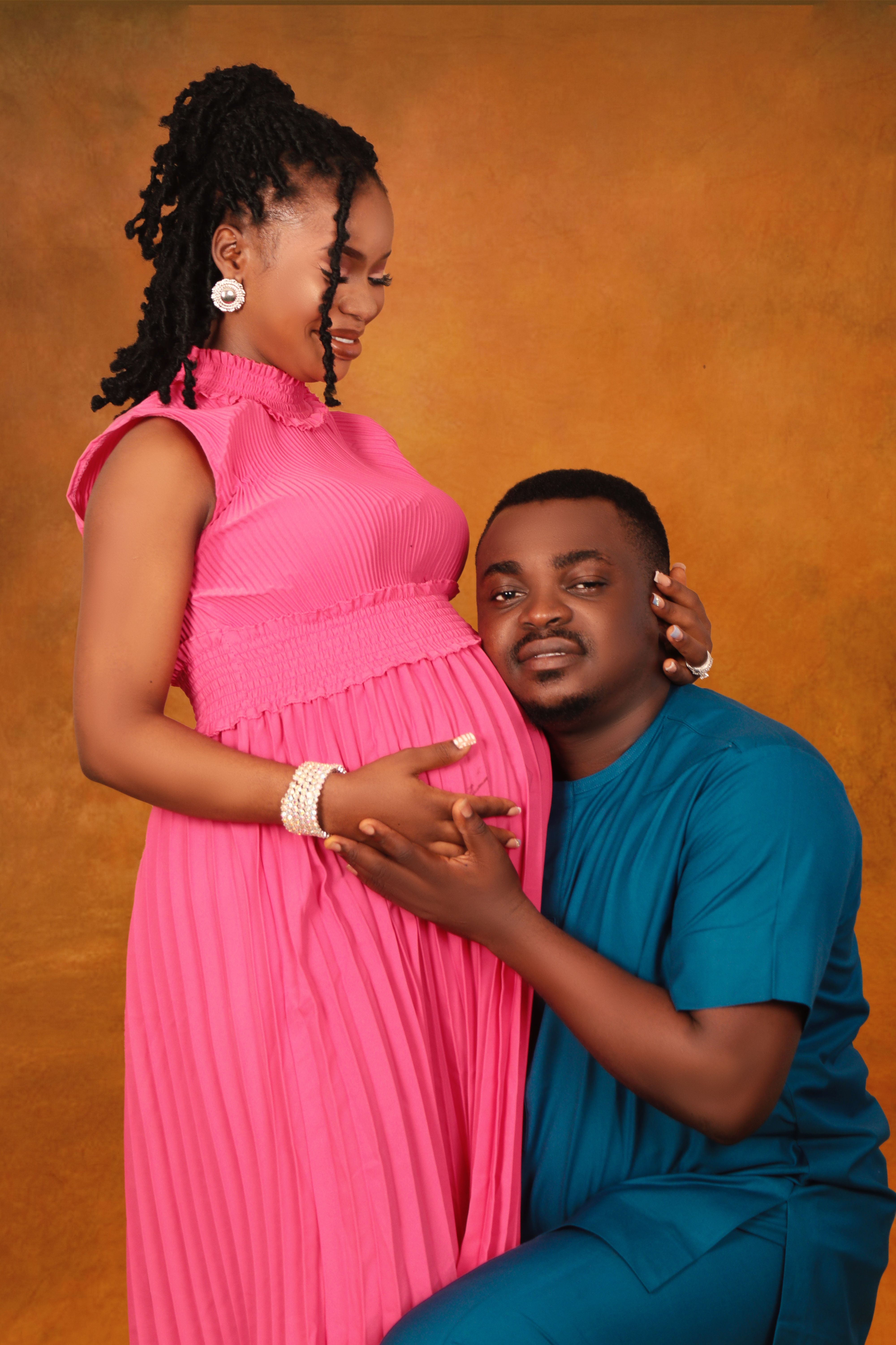 Expectant Couple Embracing Joyful Motherhood · Free Stock Photo