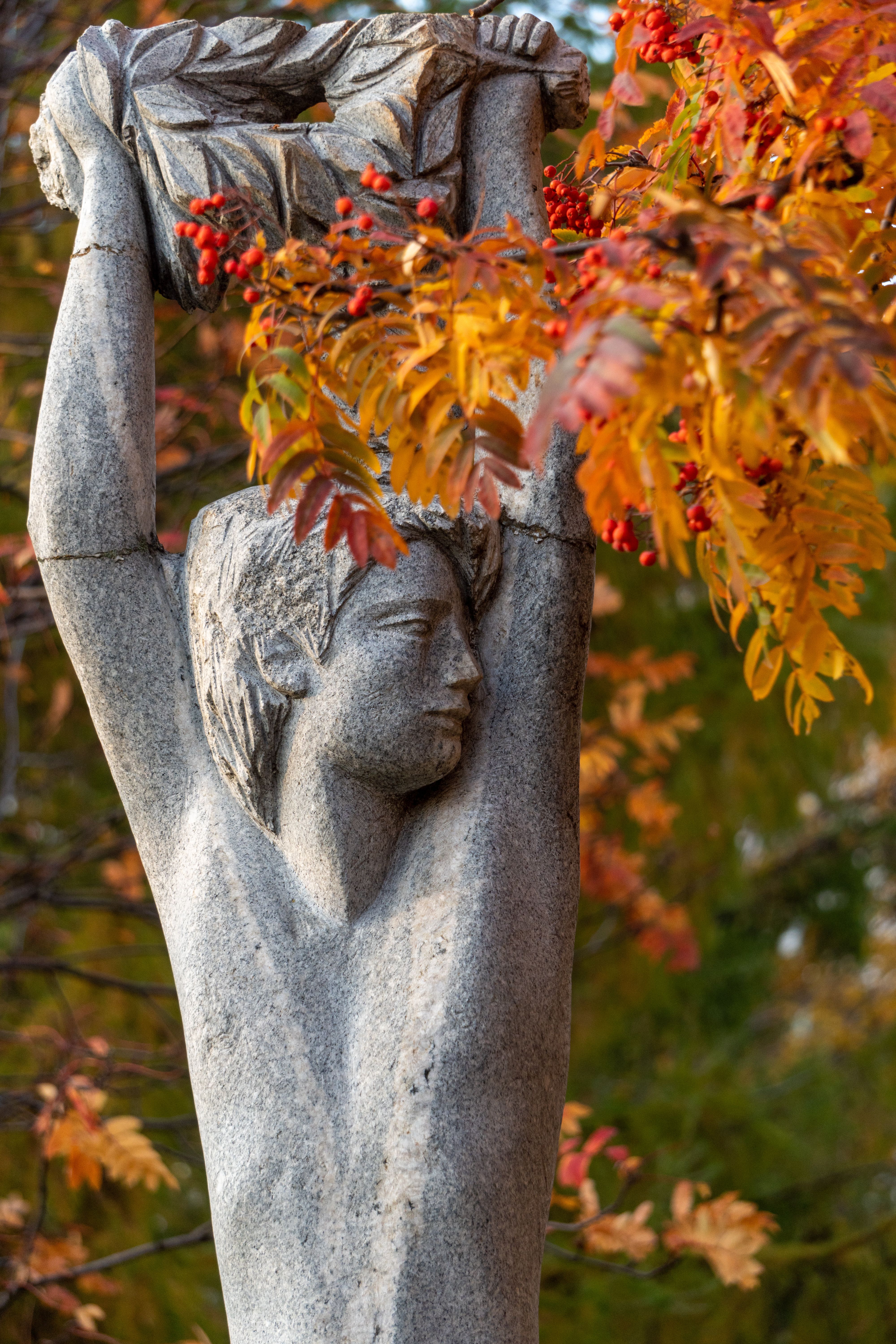 Stone Sculpture Amid Autumn Foliage · Free Stock Photo