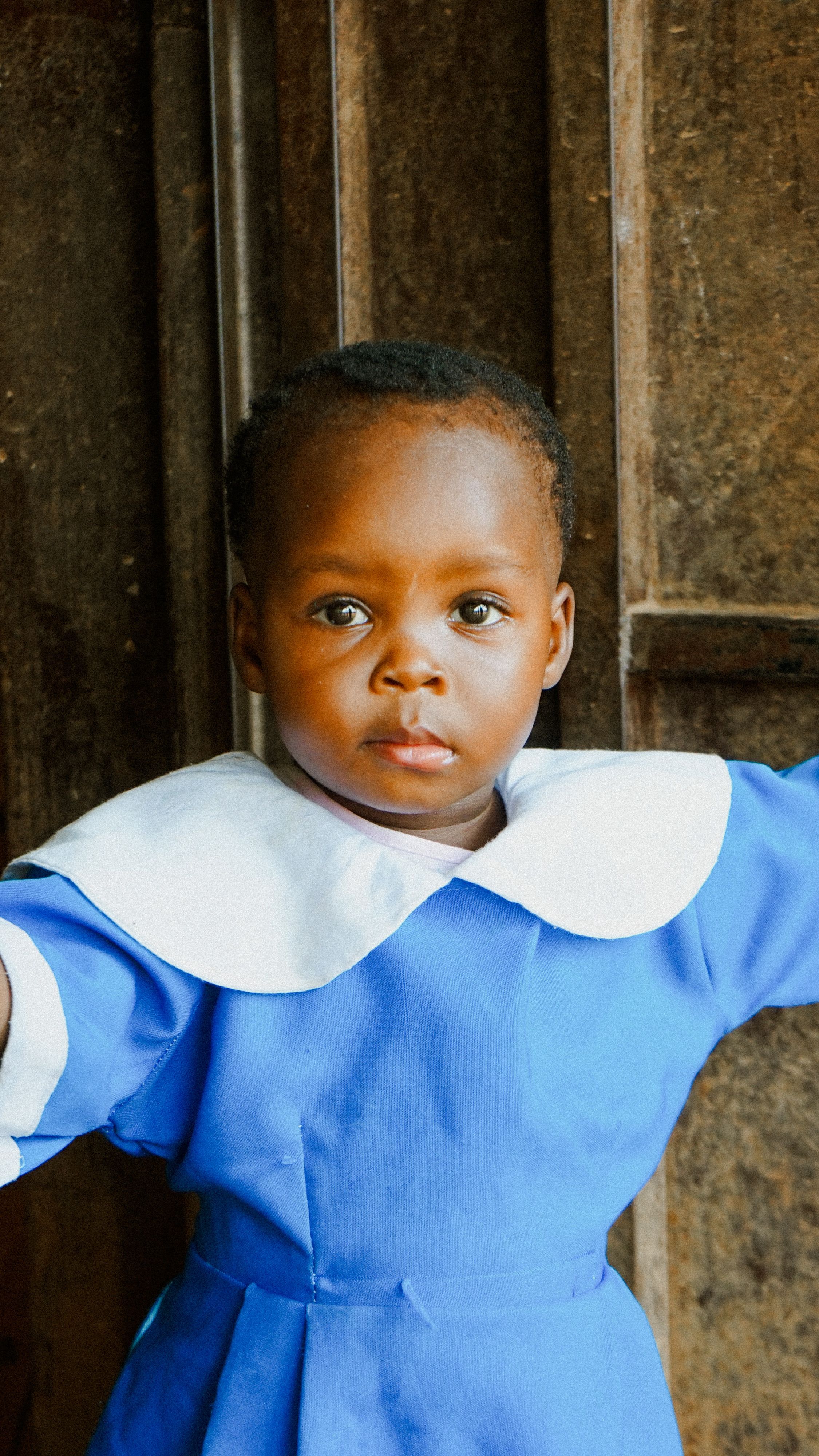 Portrait of a Child in Blue School Uniform · Free Stock Photo