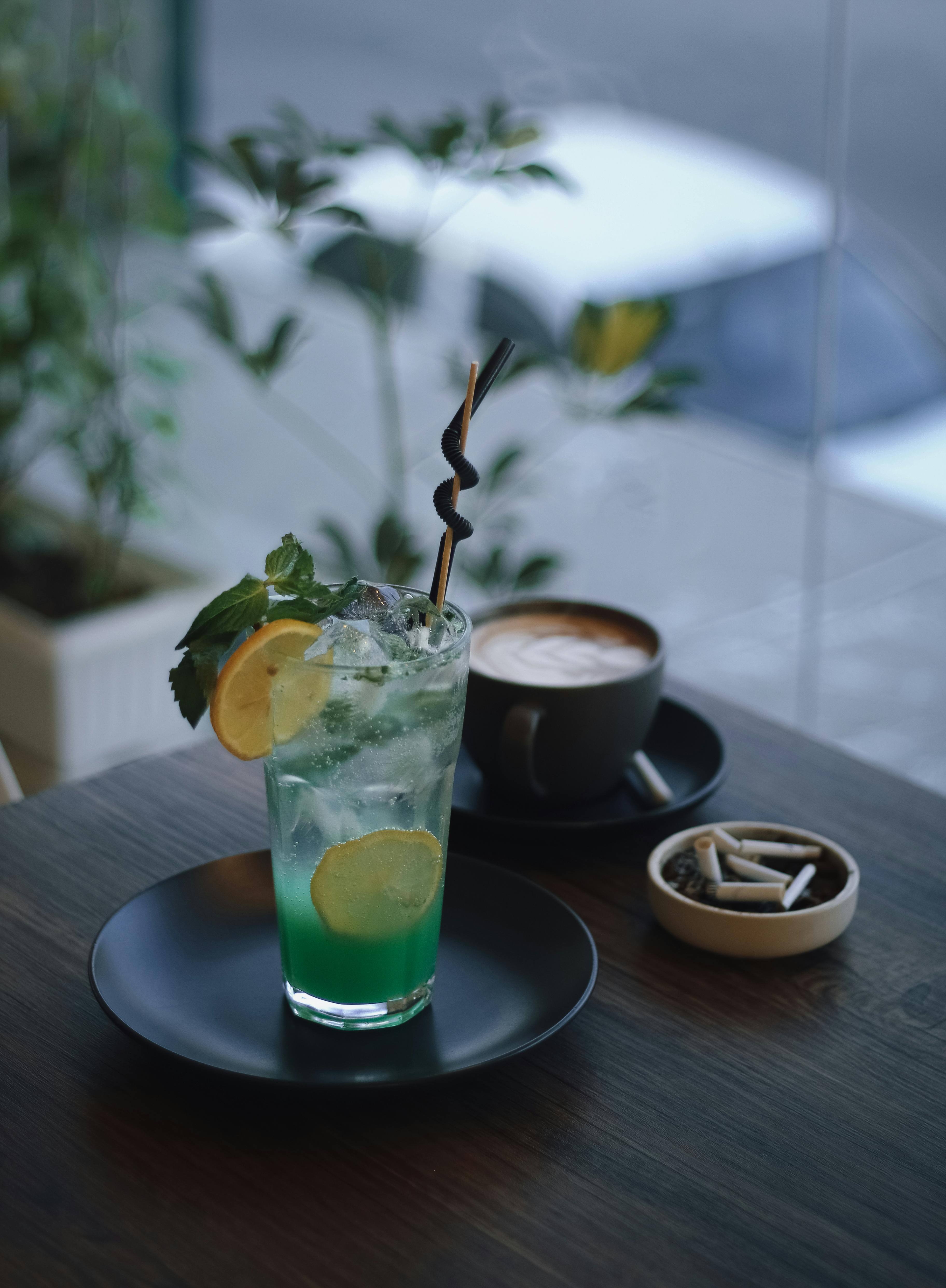 Refreshing Lemonade and Coffee Set in Cozy Café · Free Stock Photo