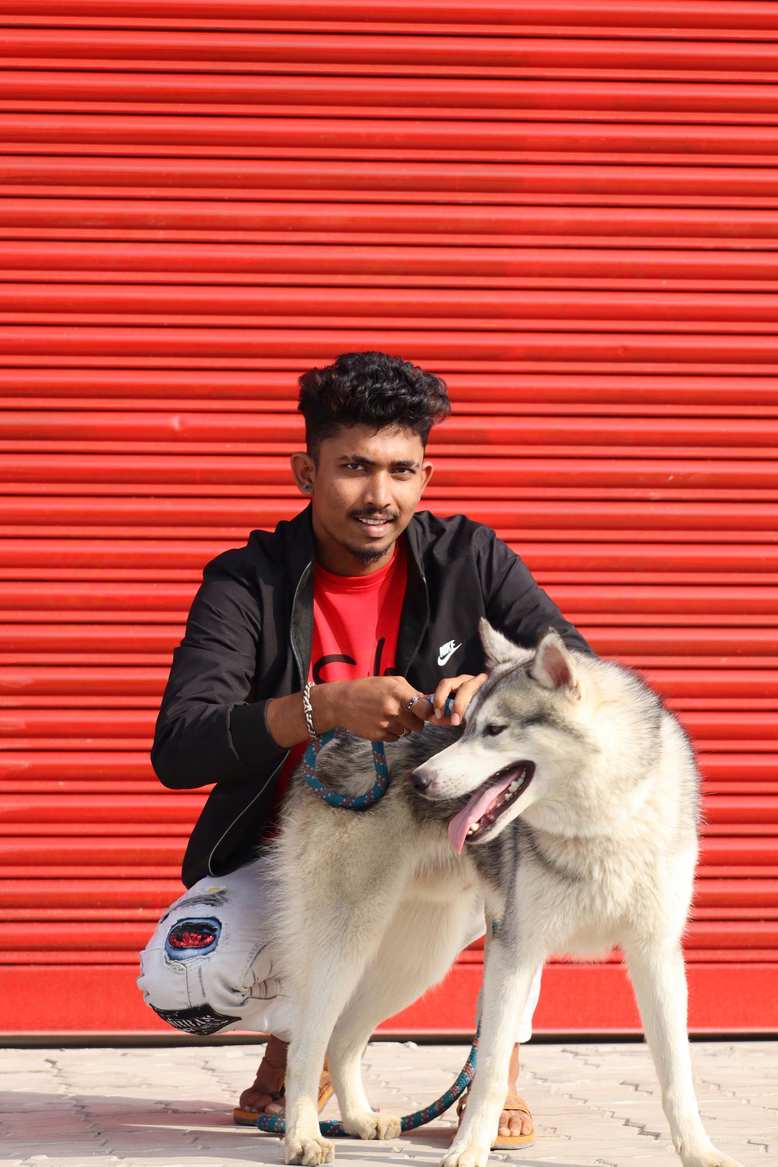Man with Siberian Husky in Urban Setting · Free Stock Photo