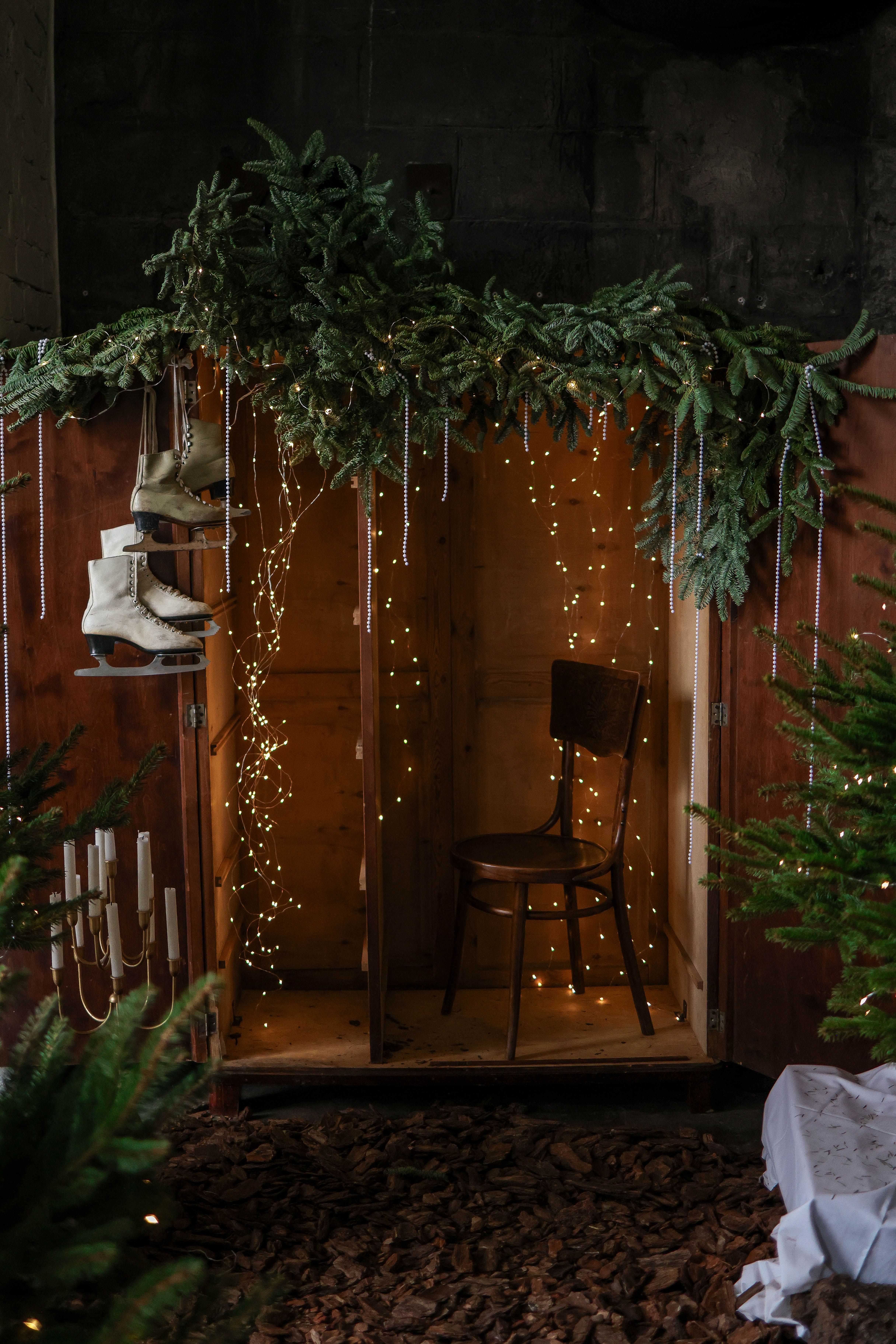 Cozy Winter Cabin Scene with Ice Skates and Lights · Free Stock Photo