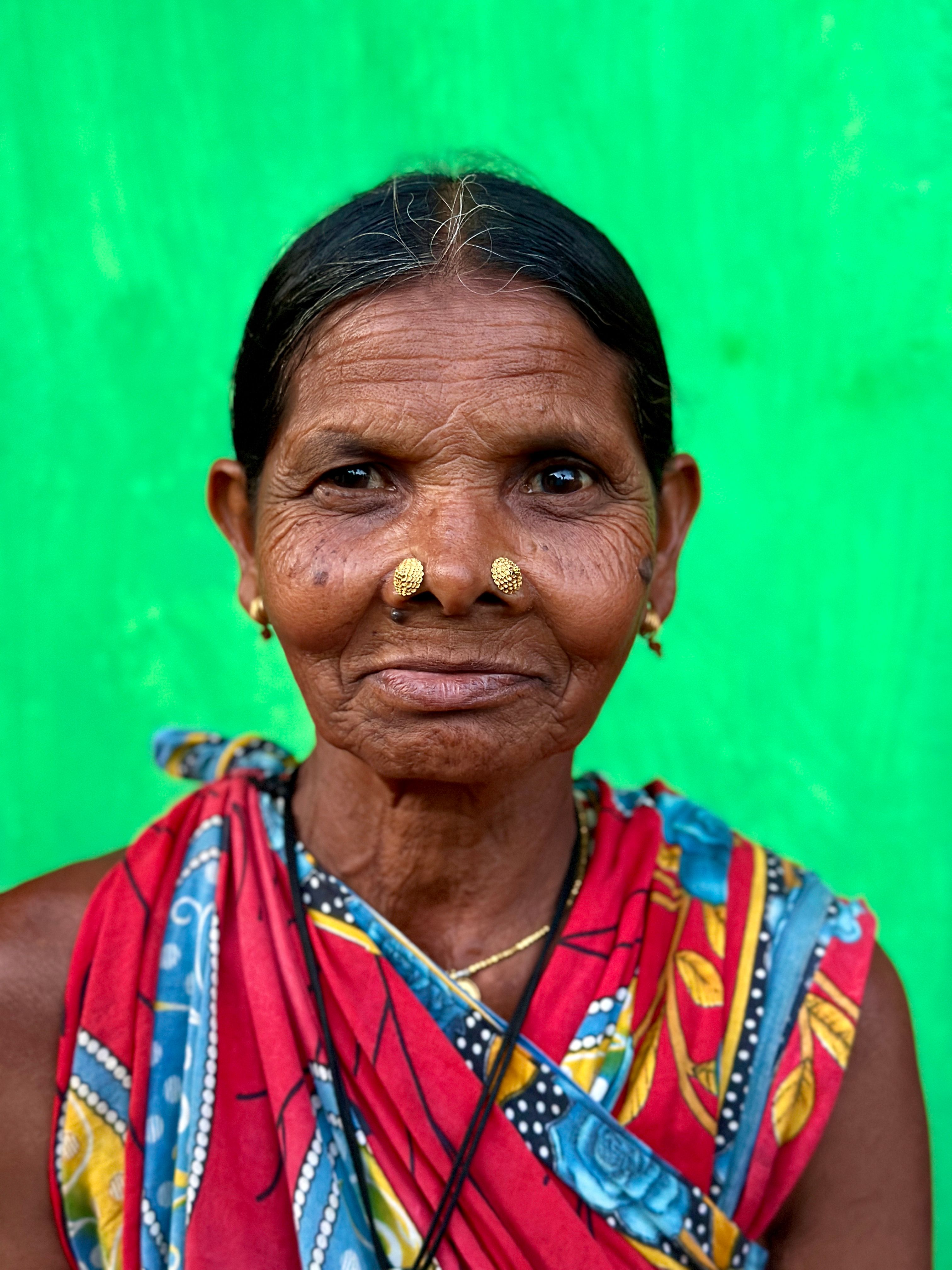 Elderly Woman in Traditional Colorful Attire · Free Stock Photo