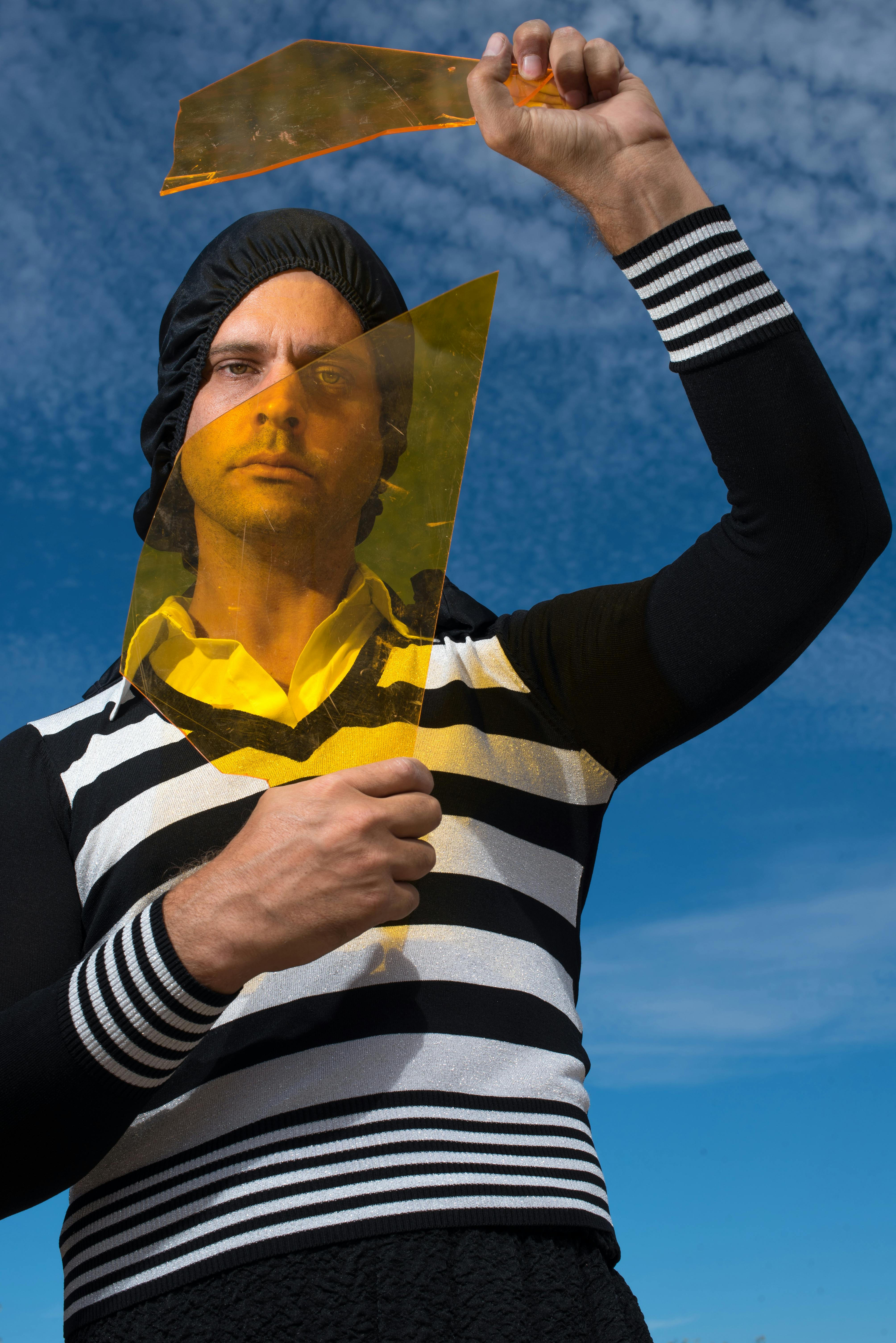 Artistic Portrait with Yellow Glass and Stripes · Free Stock Photo