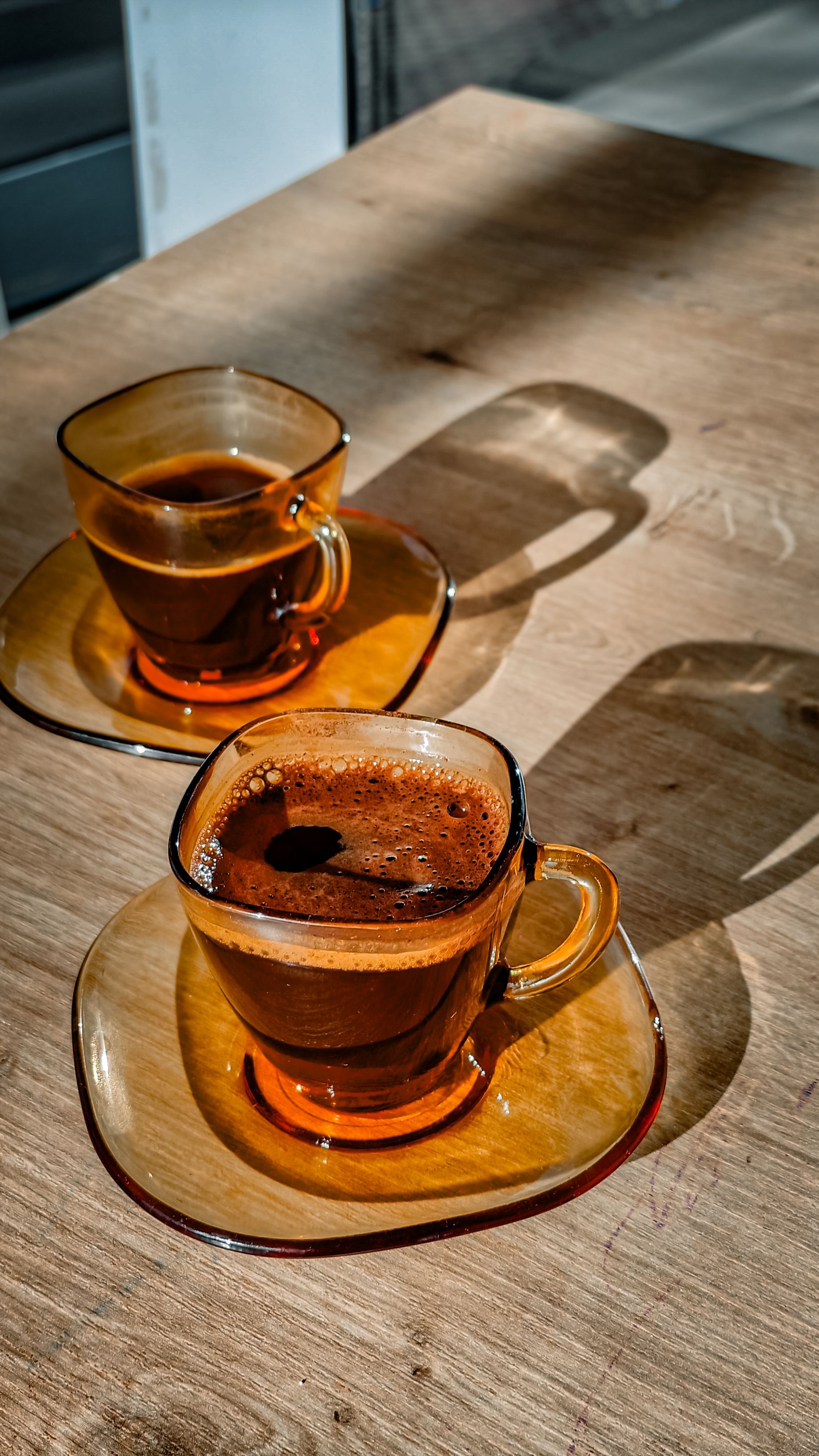 Elegant Glass Cups with Espresso on Wooden Table · Free Stock Photo