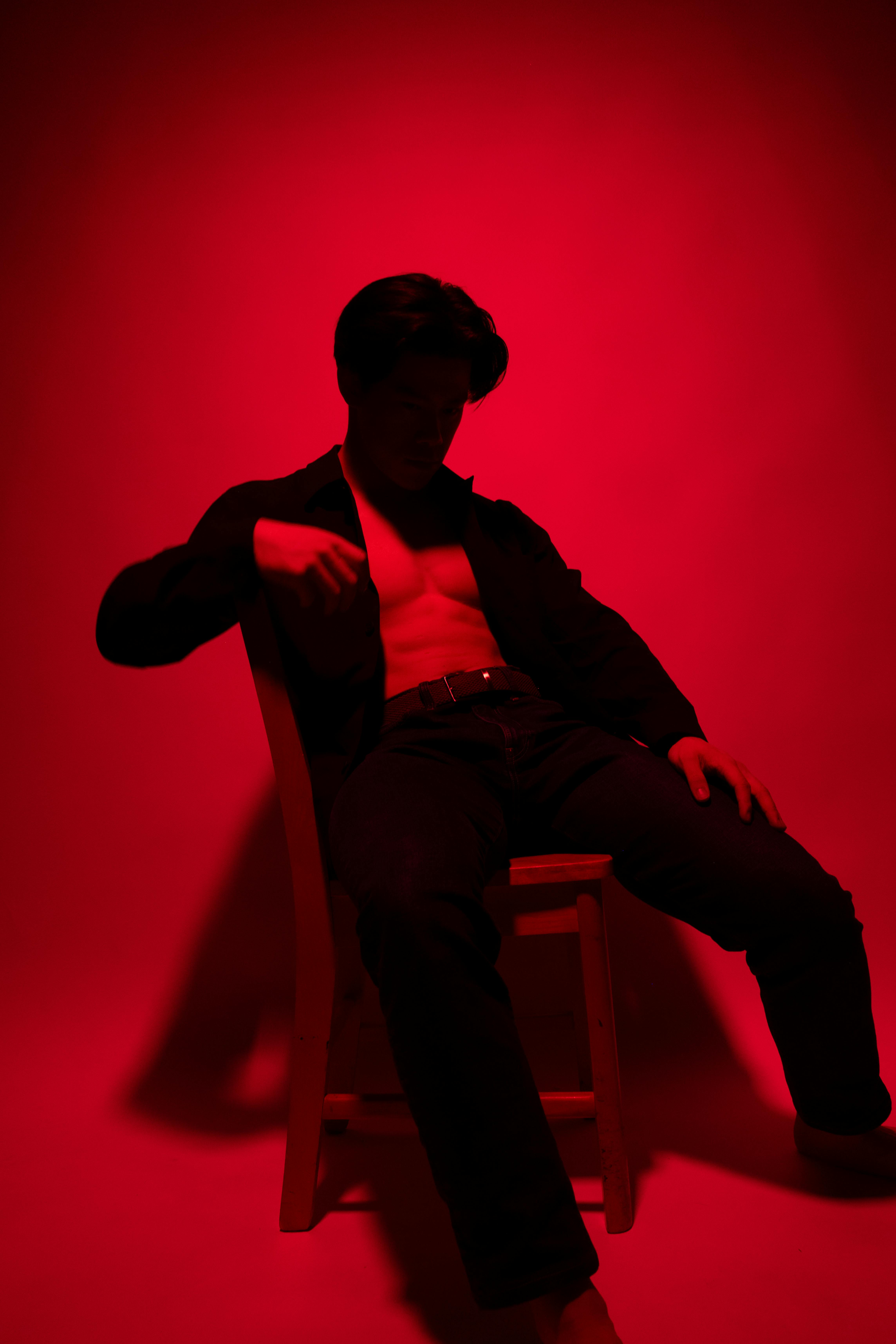 Moody Portrait of Man in Red Light Setting · Free Stock Photo