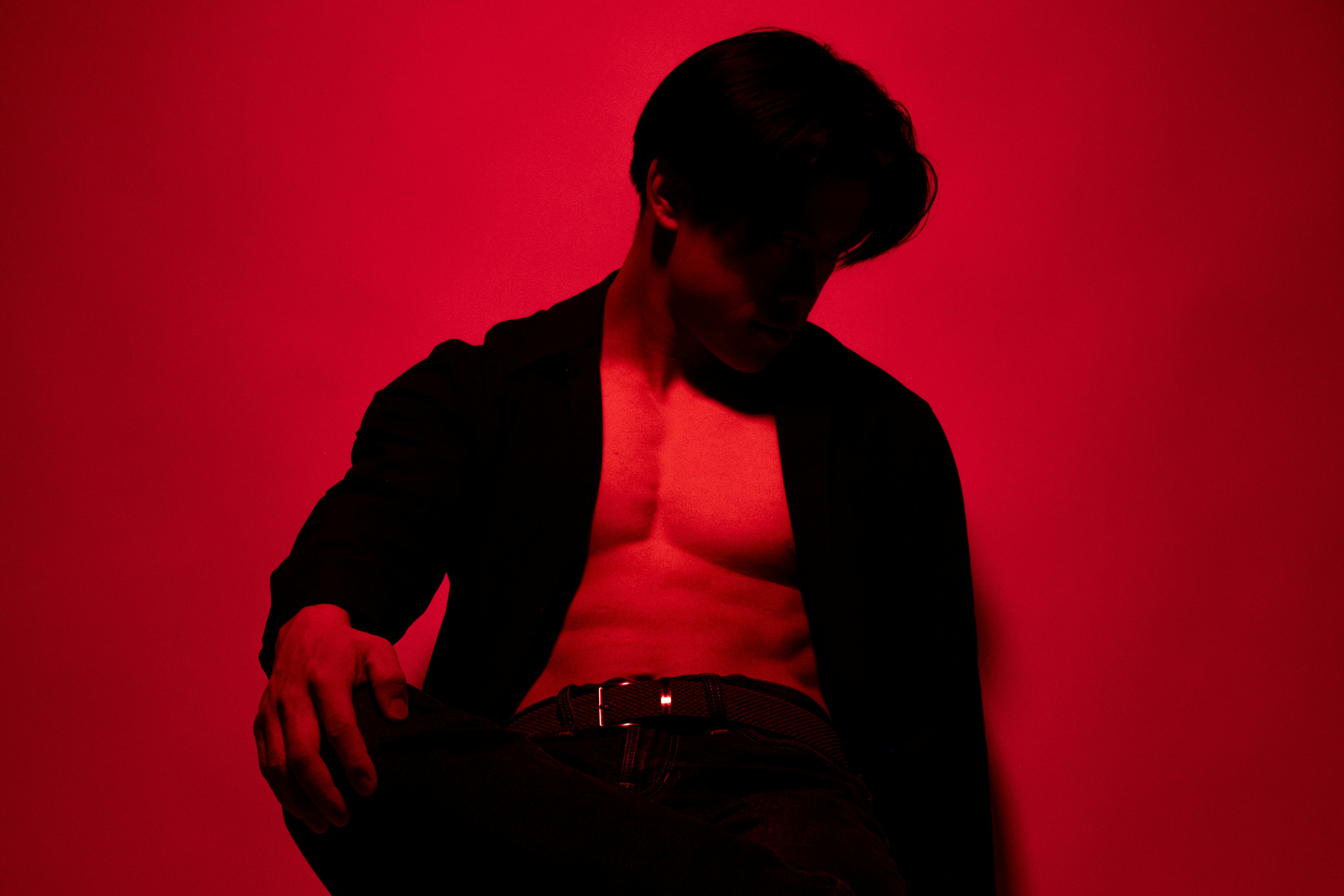 Dramatic Muscular Male Portrait with Red Lighting · Free Stock Photo