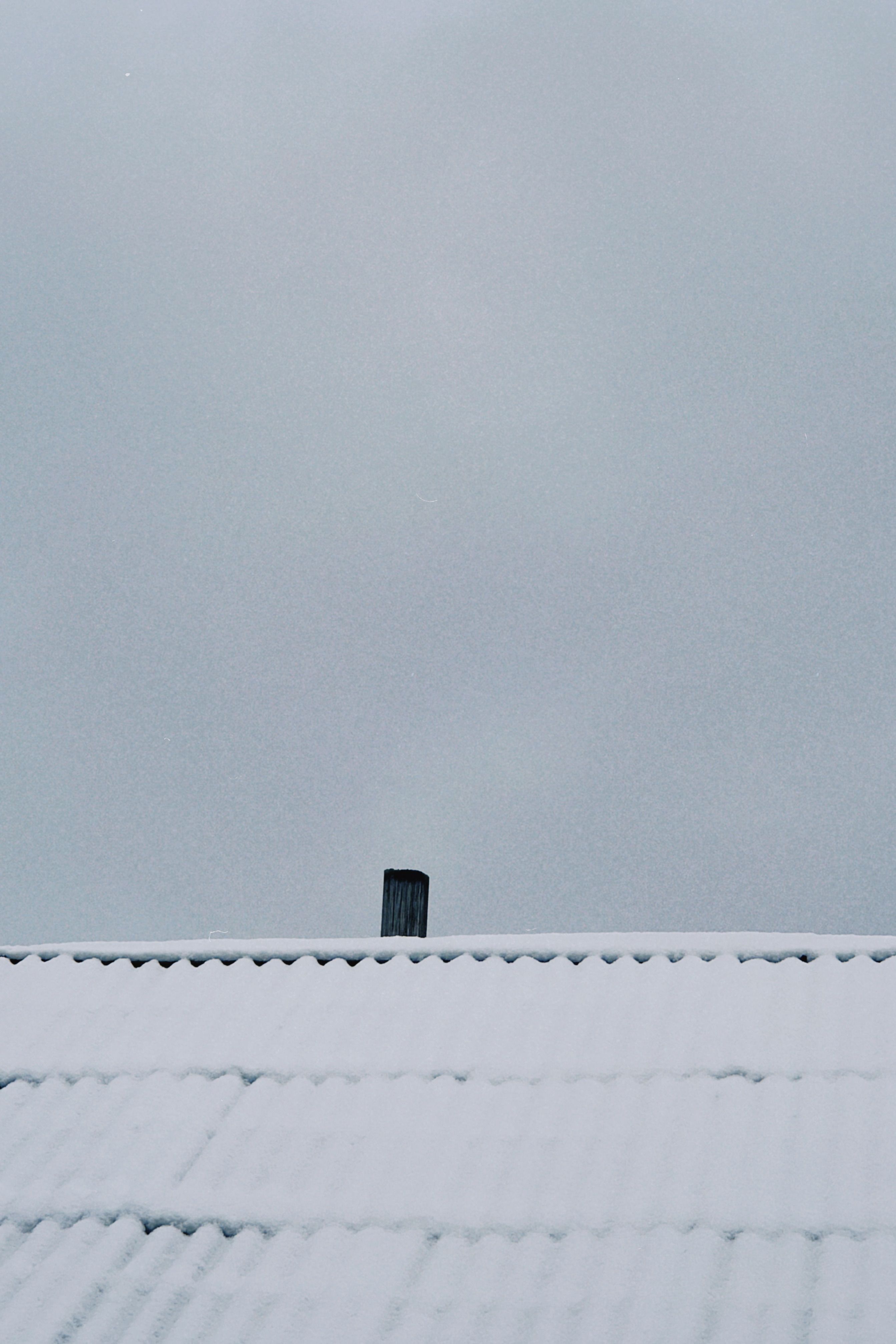 Snow-Covered Roof with Chimney in Winter Talgar · Free Stock Photo