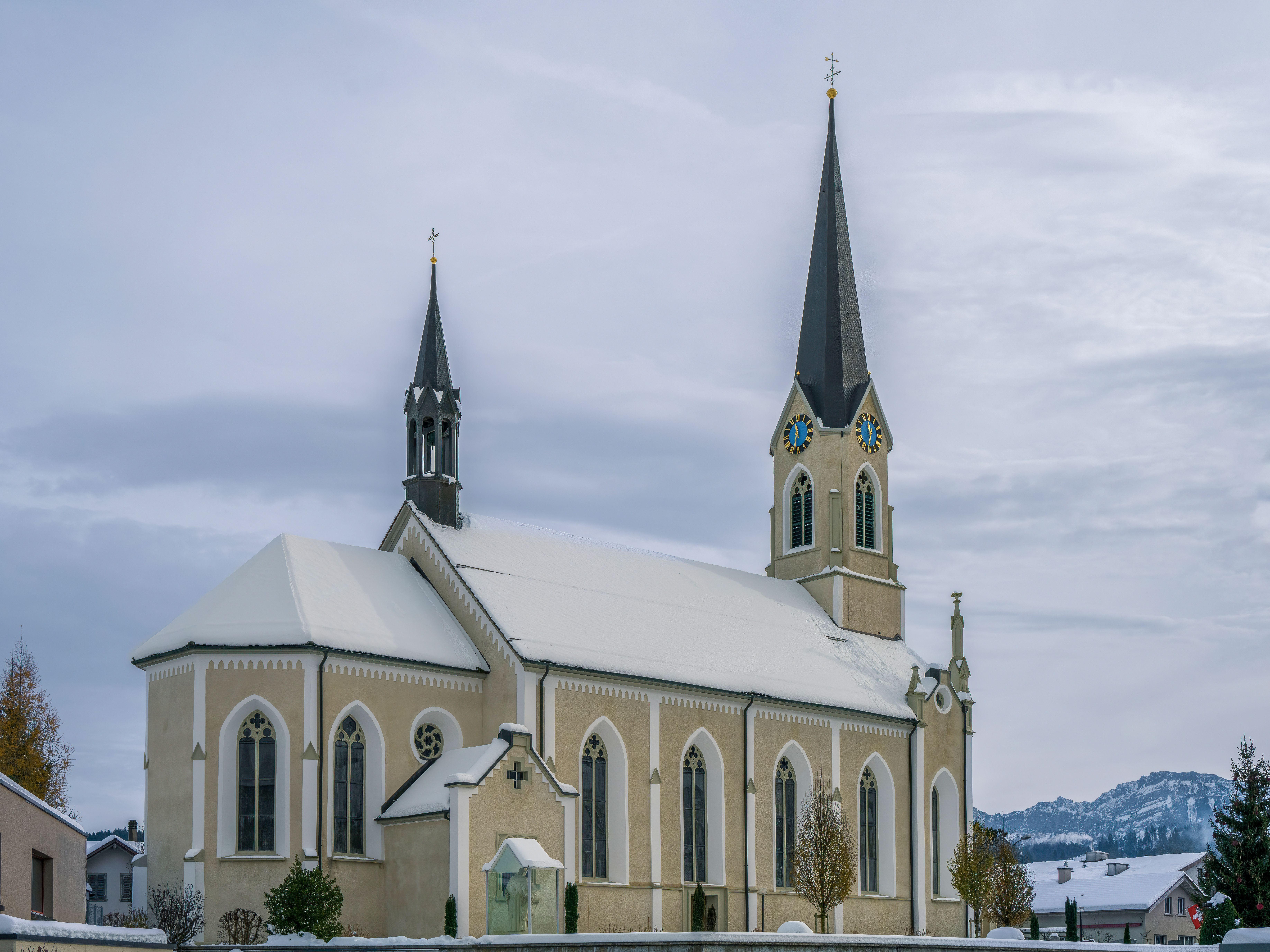 Gothic Church with Snowy Skyline in Winter · Free Stock Photo