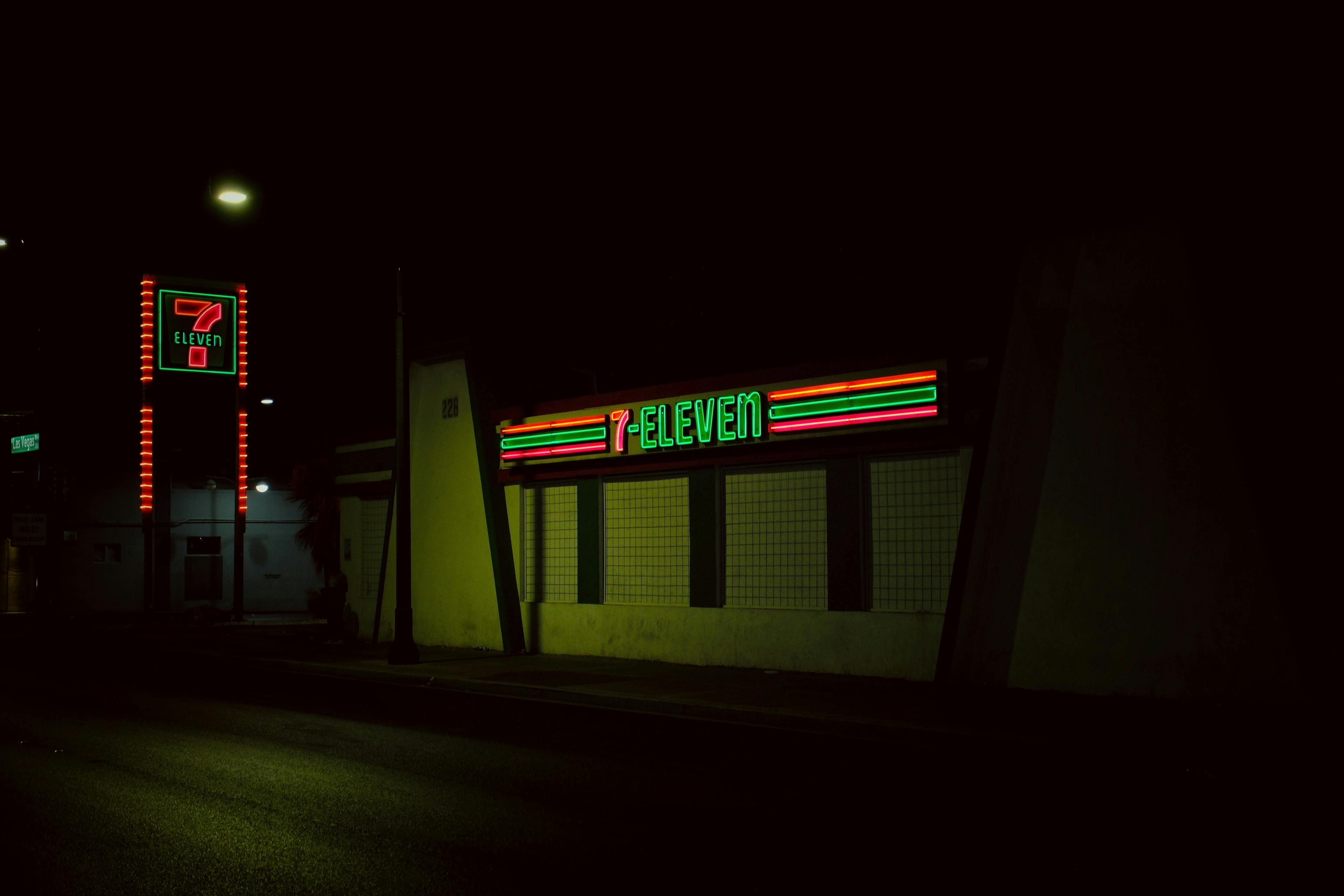 Neon-lit 7-Eleven store at night in Las Vegas · Free Stock Photo