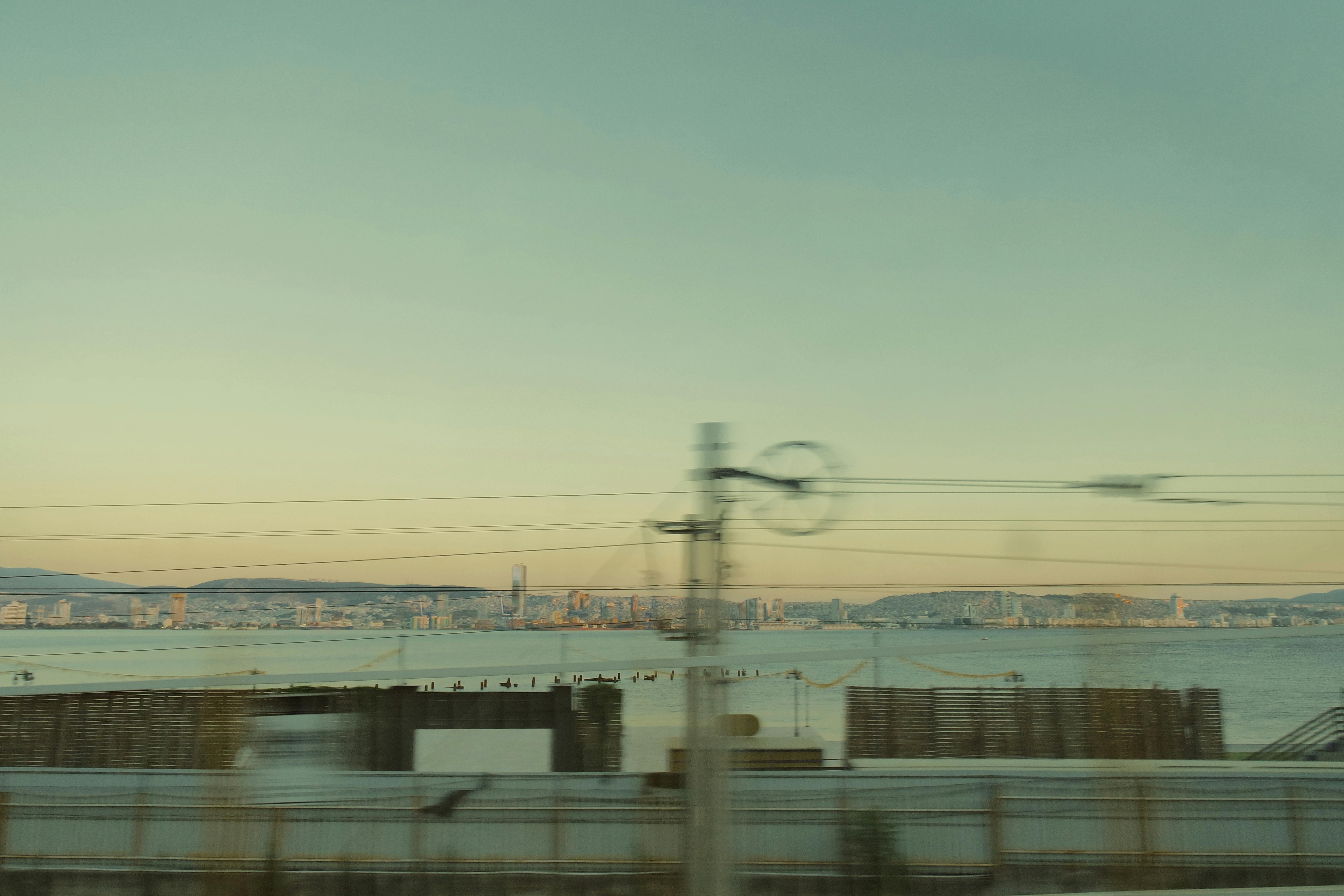 Serene Coastal Cityscape with Distant Skyline · Free Stock Photo