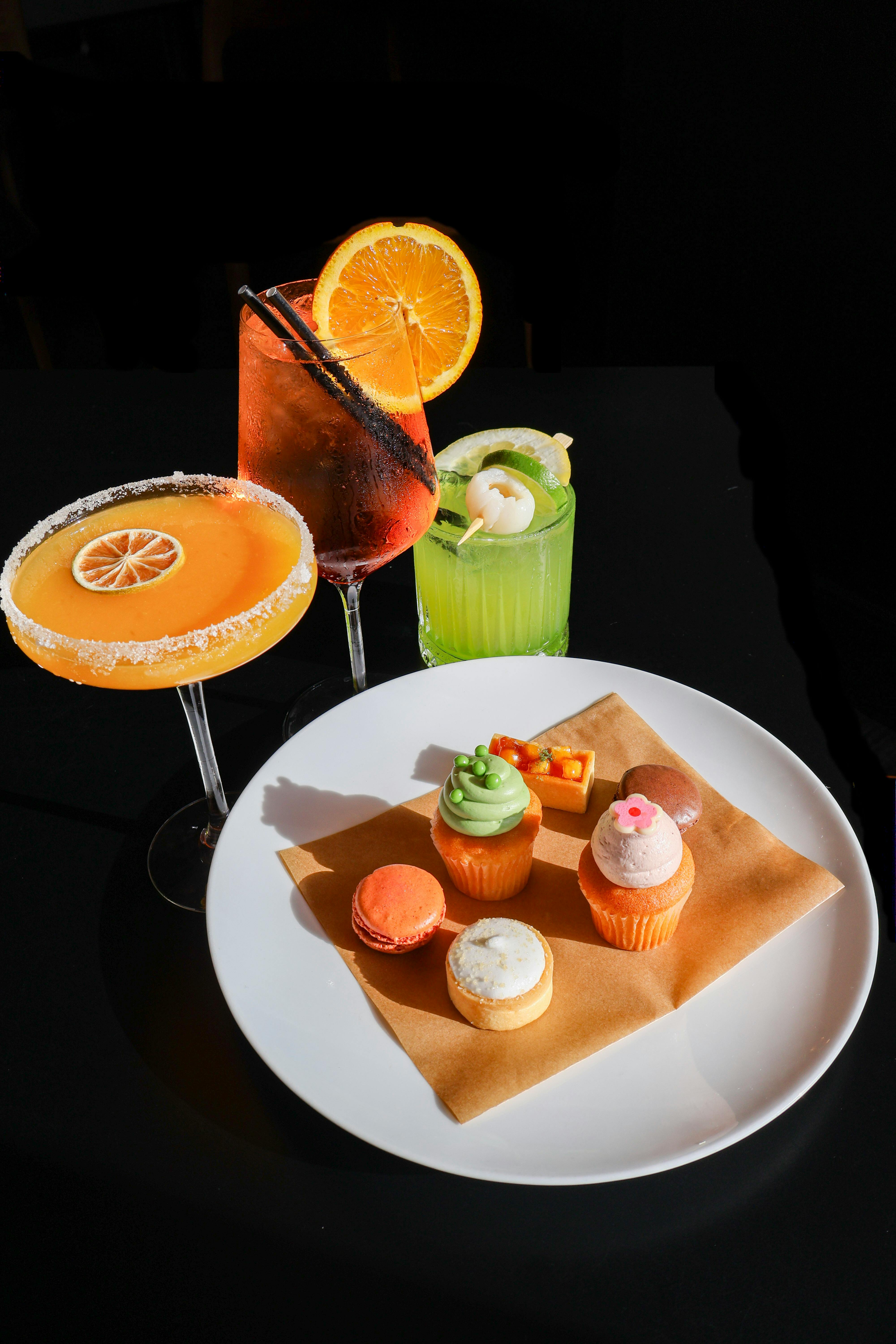 Vibrant Cocktails and Desserts with Citrus Garnishes · Free Stock Photo