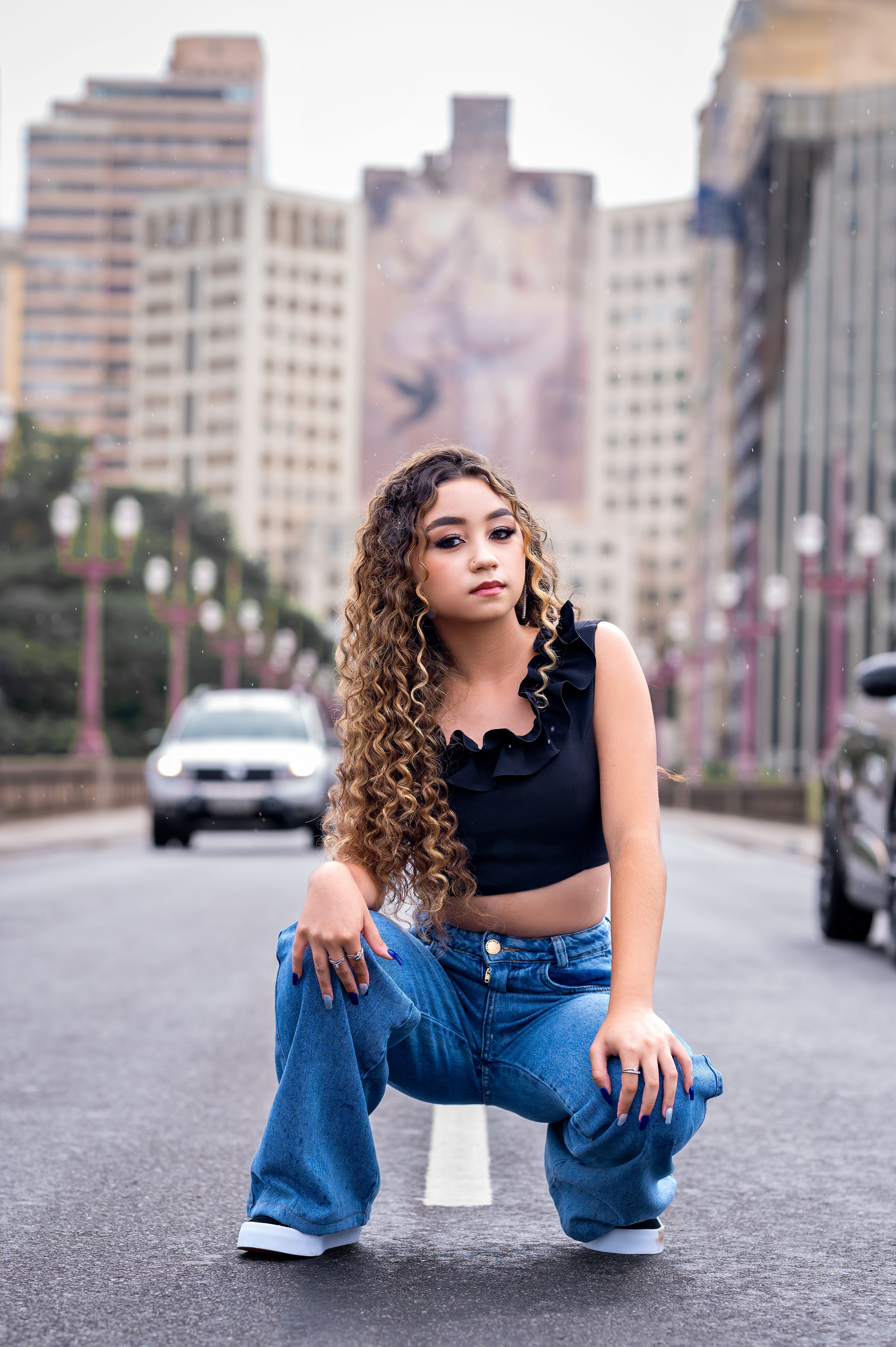 Young Woman Posing on Urban Street · Free Stock Photo