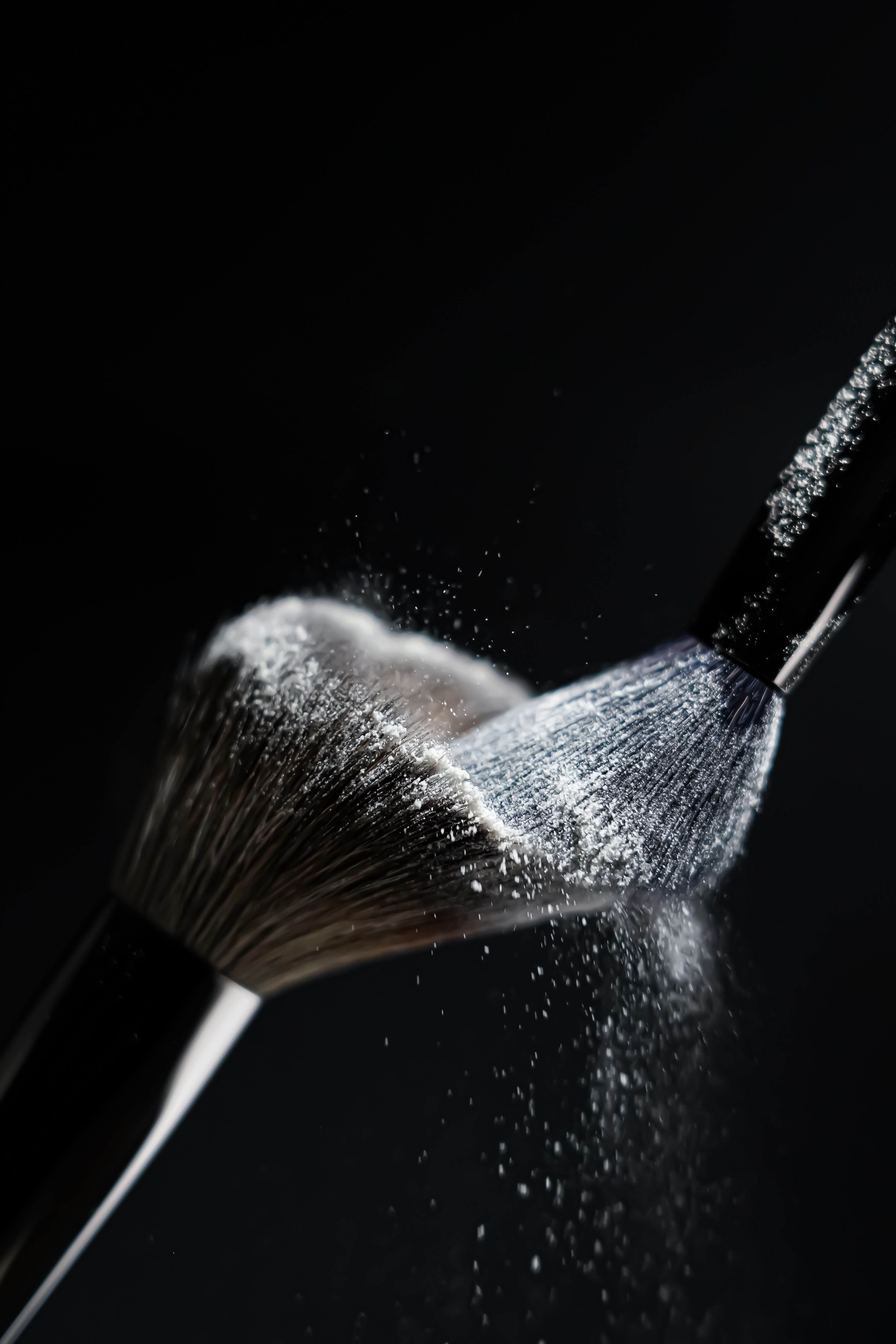 Cosmetics Makeup Brushes and Powder Dust Explosion · Free Stock Photo