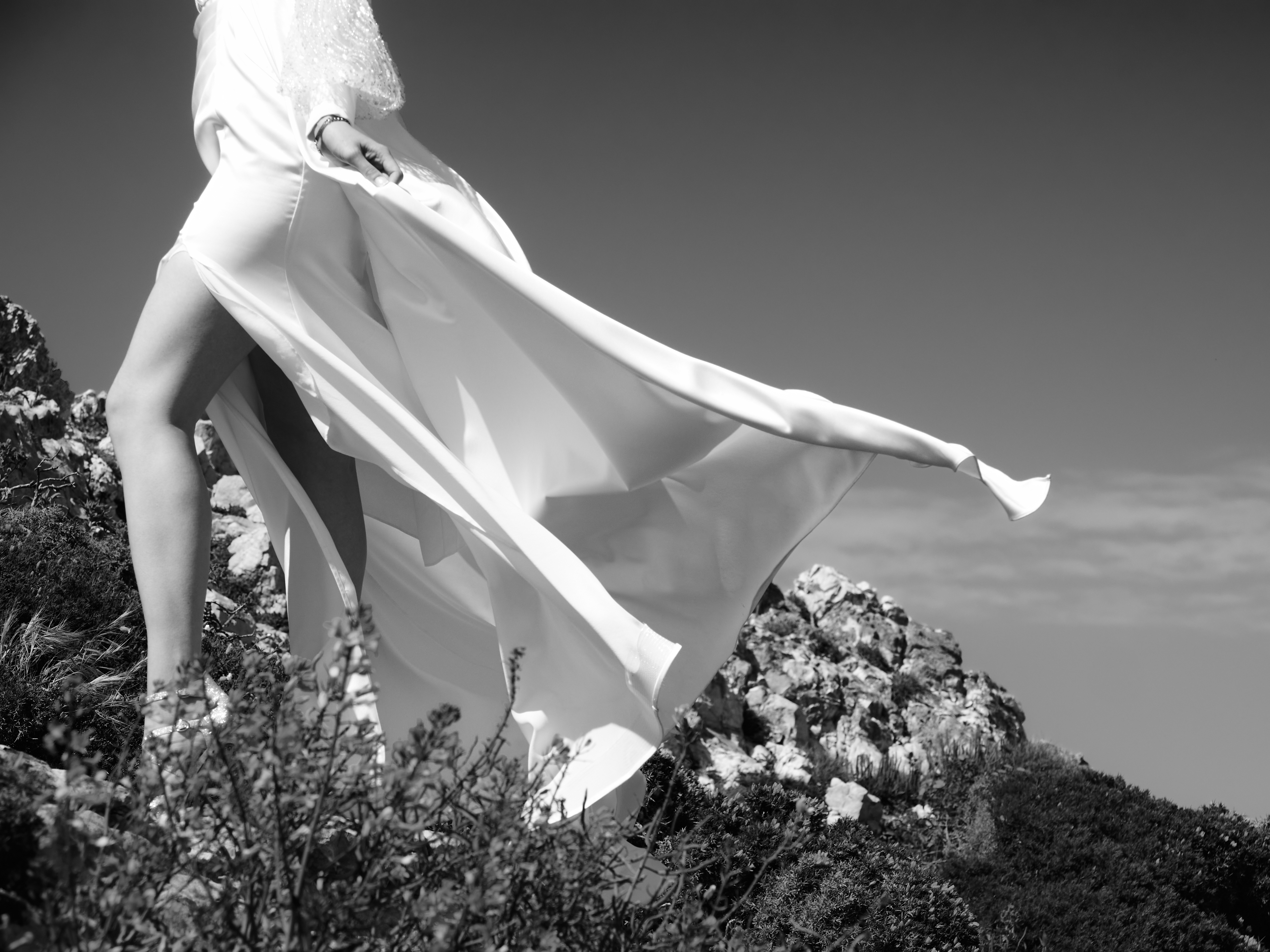 Elegant Flowing Dress in Dramatic Outdoor Scene · Free Stock Photo