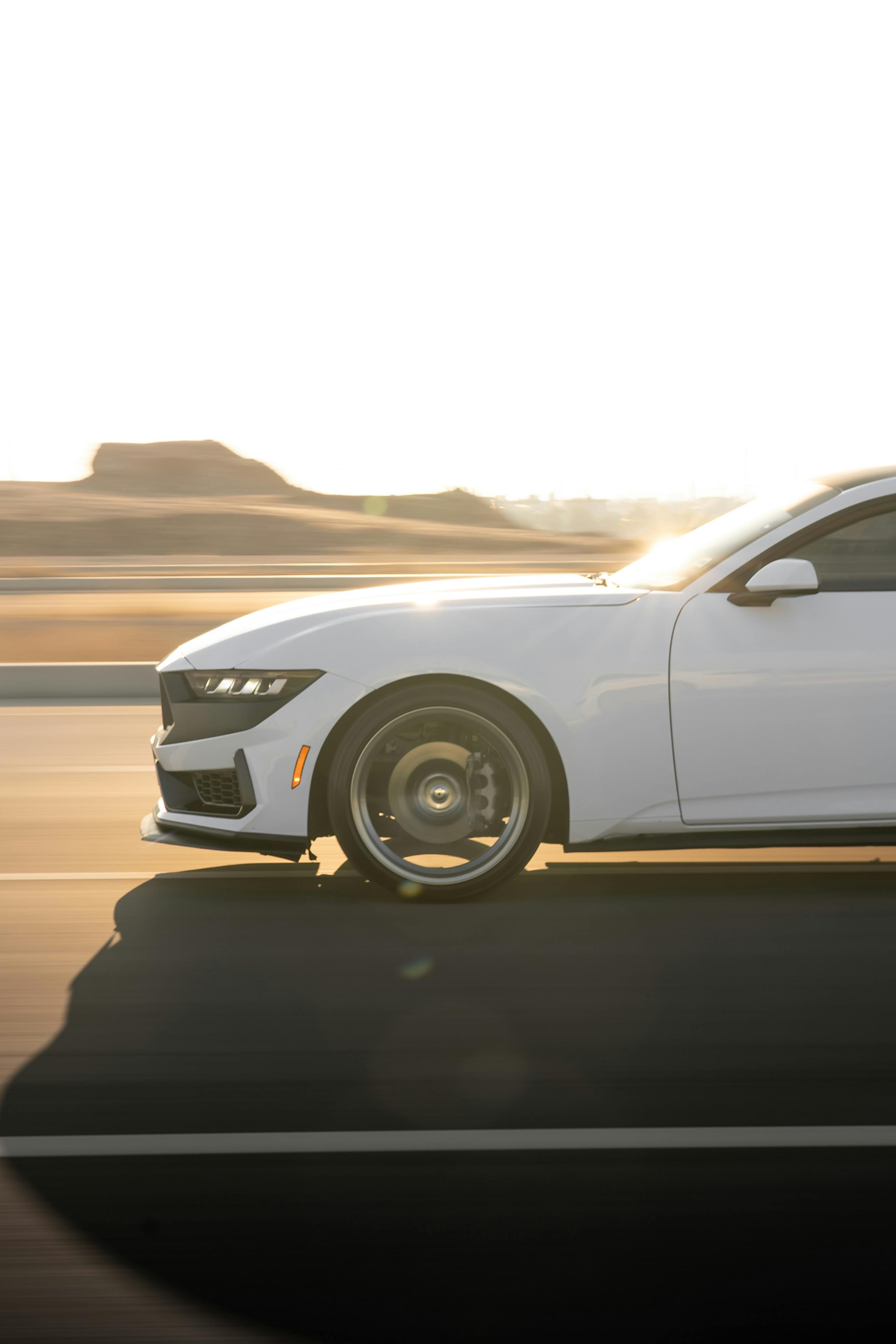 Dynamic Side View of a White Luxury Car · Free Stock Photo