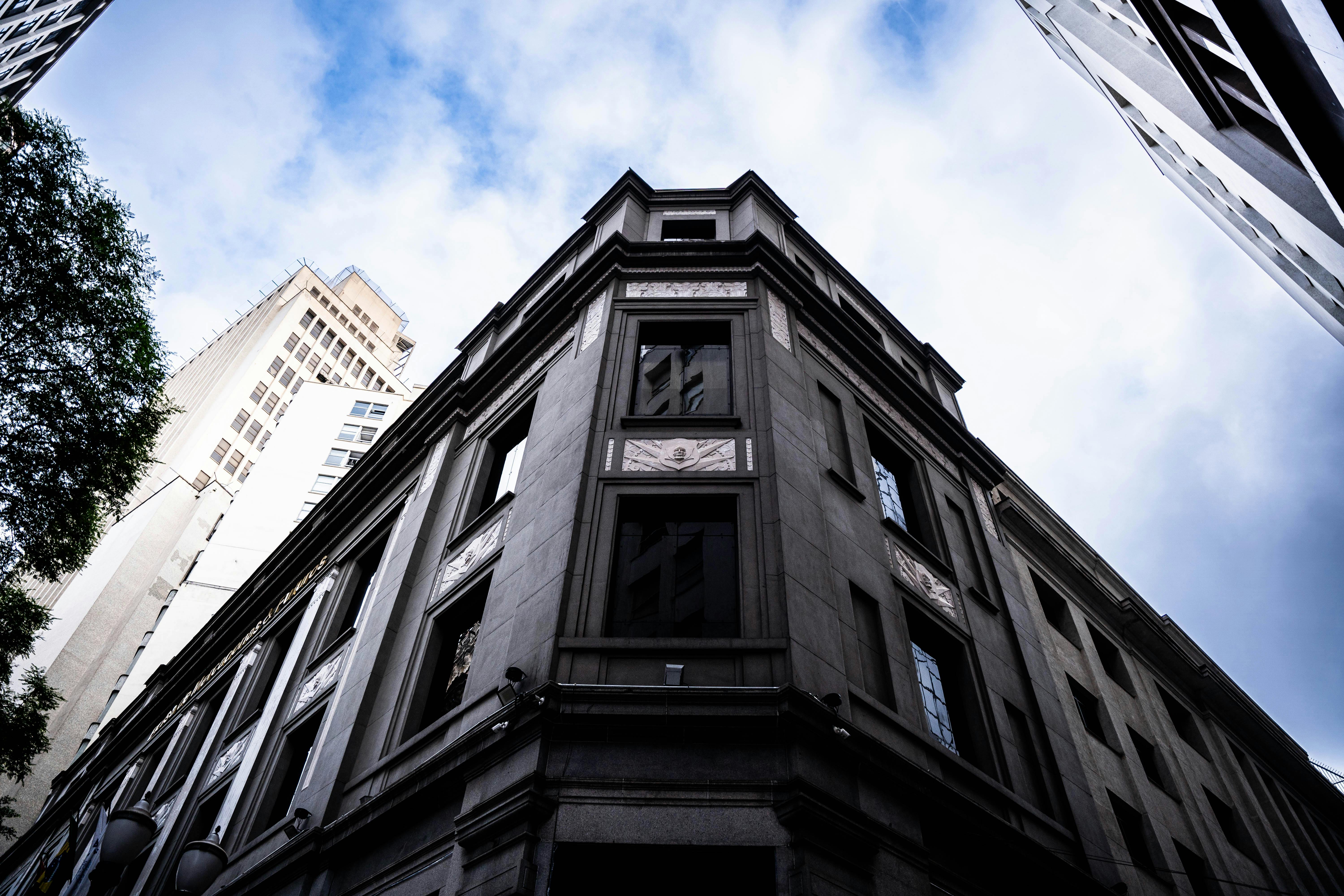 Dramatic Architectural Building with Blue Sky · Free Stock Photo