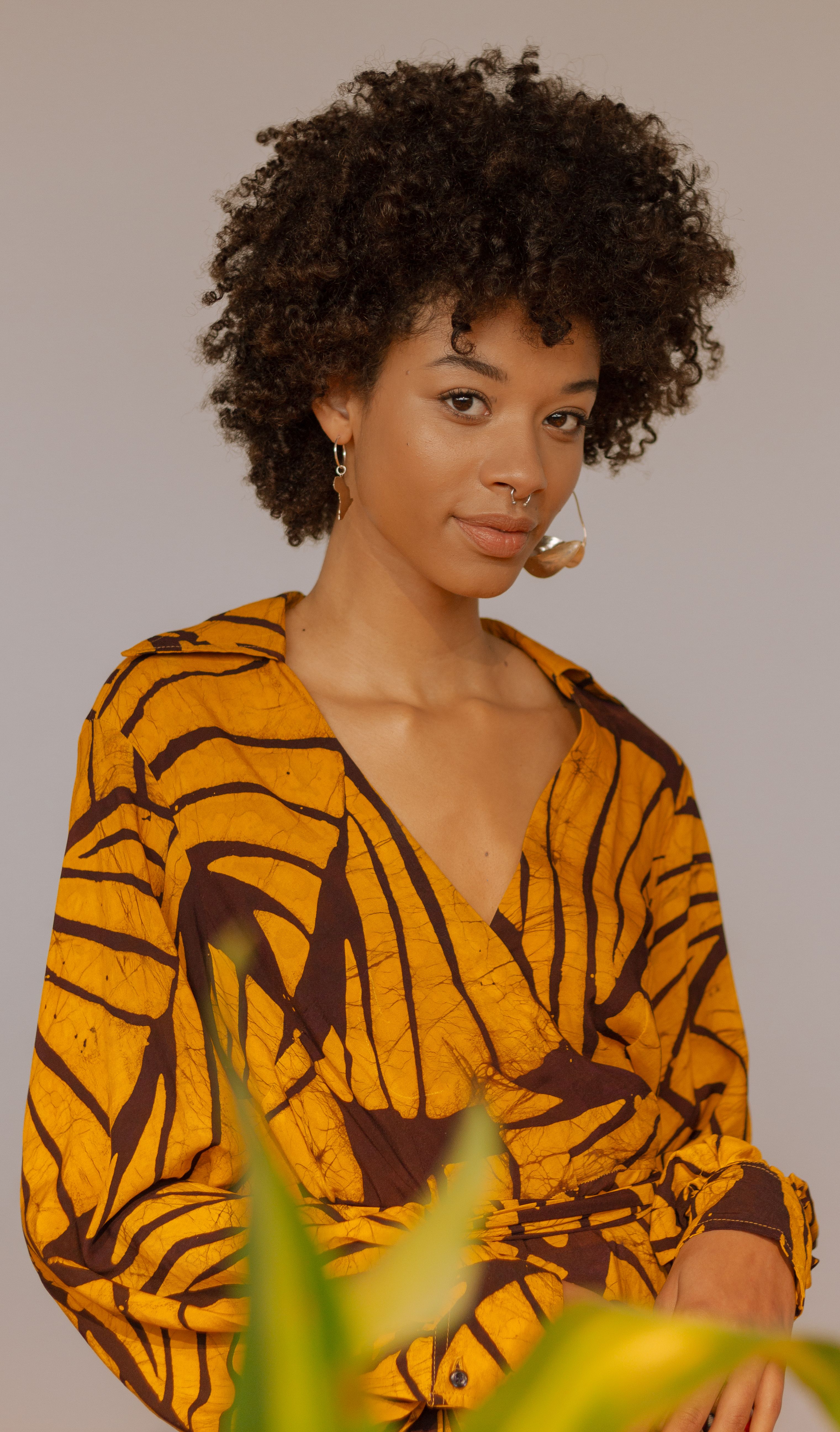 Stylish Woman in Vibrant Patterned Outfit · Free Stock Photo