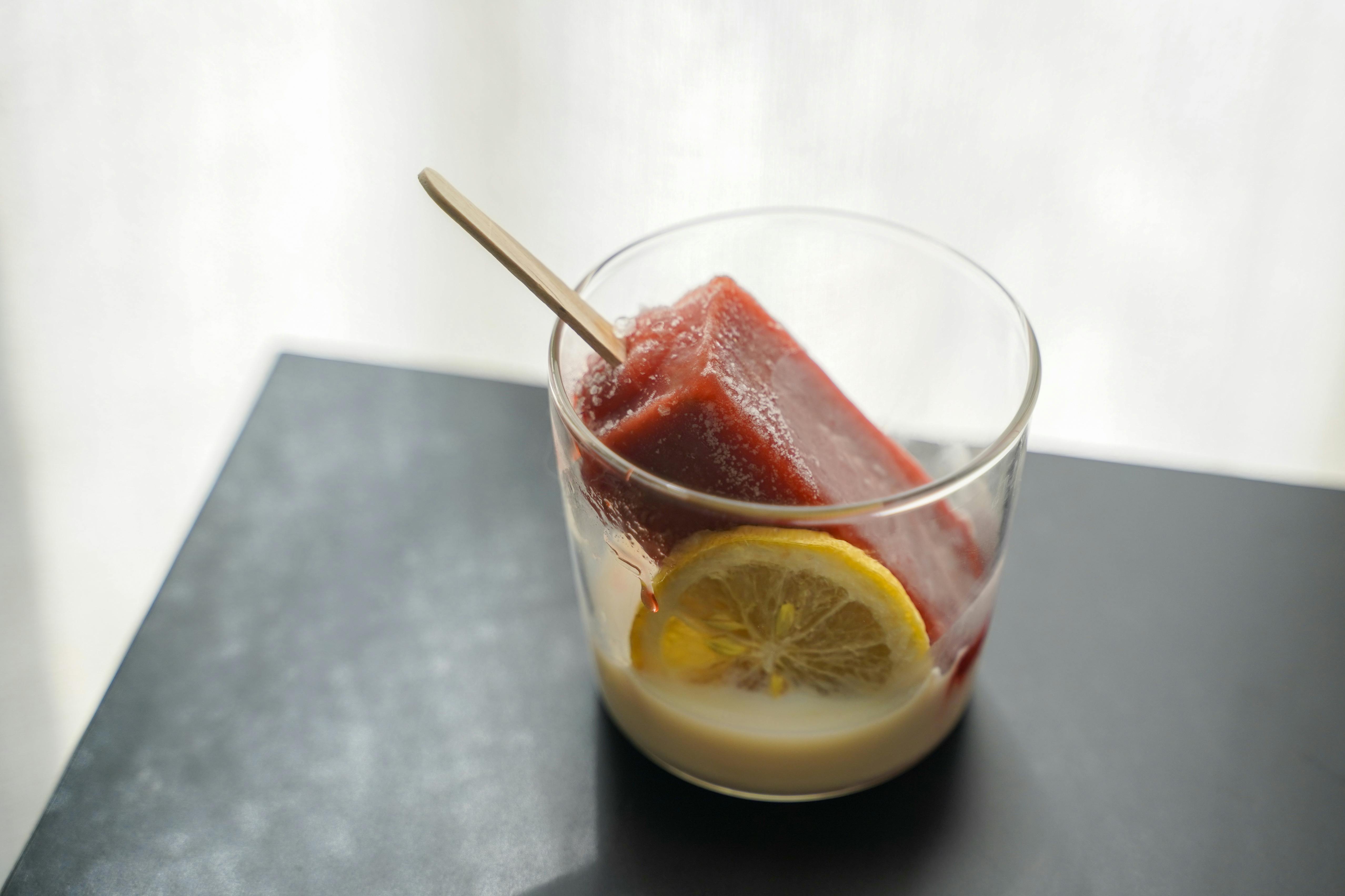 Gourmet Raspberry Paleta in Glass with Lemon Slice · Free Stock Photo