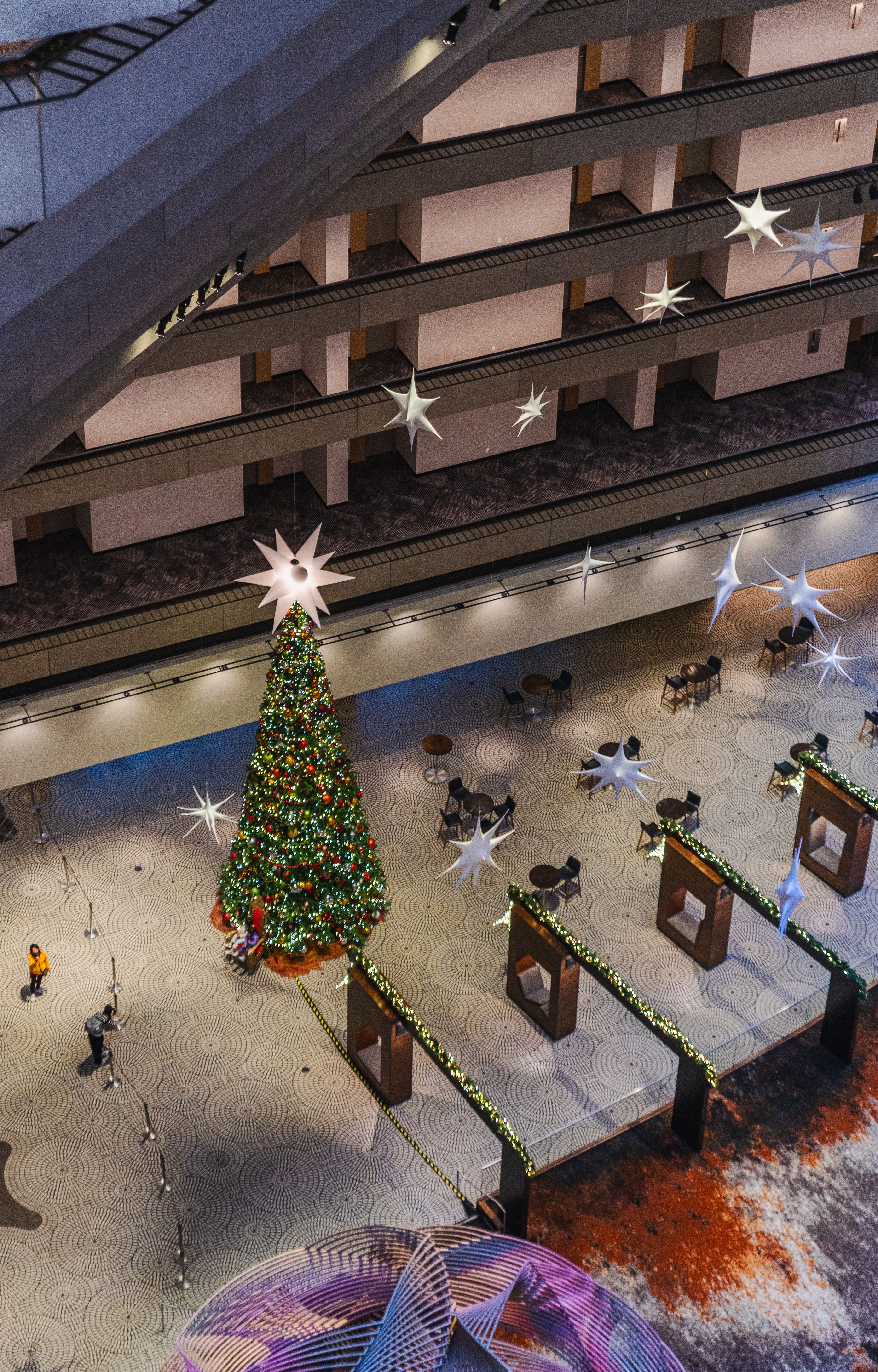 Aerial view of festive hotel lobby with Christmas tree · Free Stock Photo