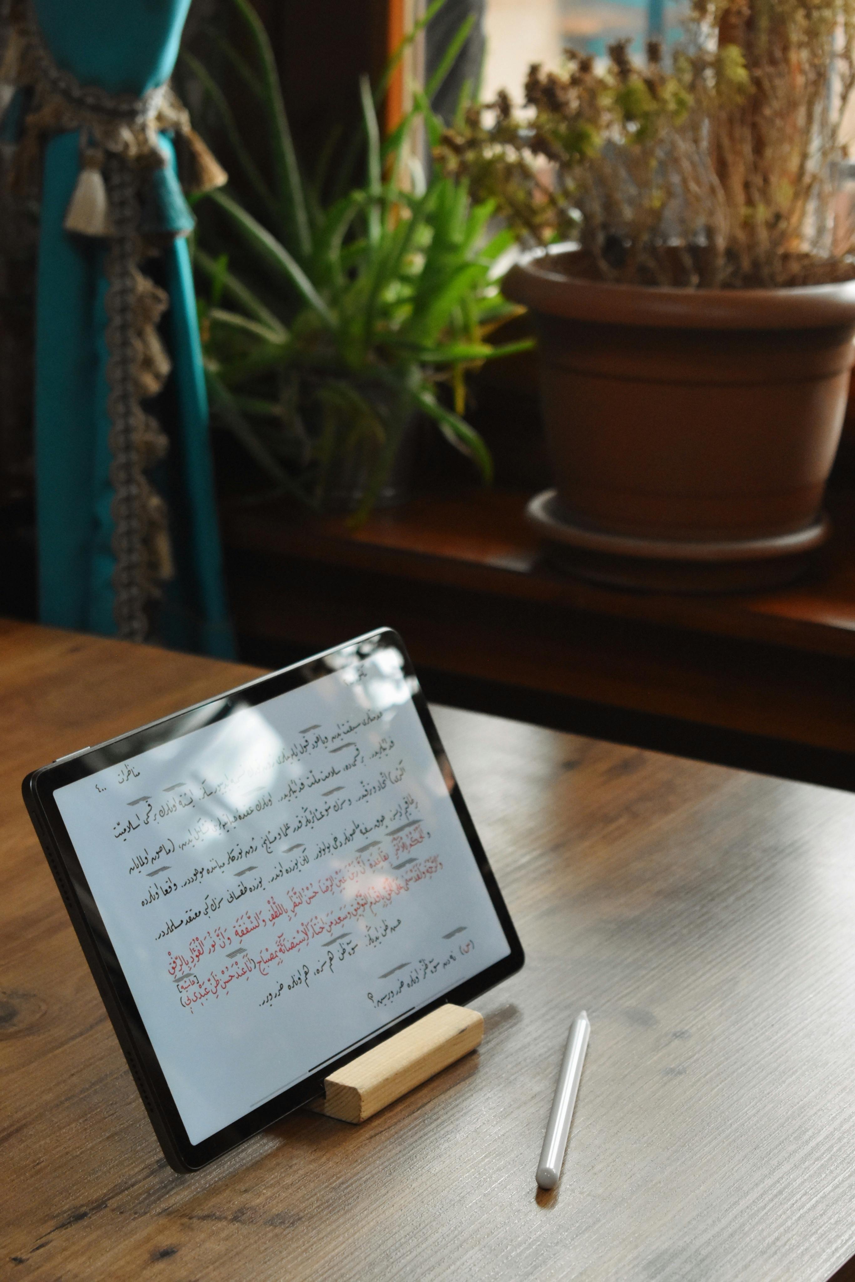 Tablet with Handwritten Notes on Wooden Table · Free Stock Photo