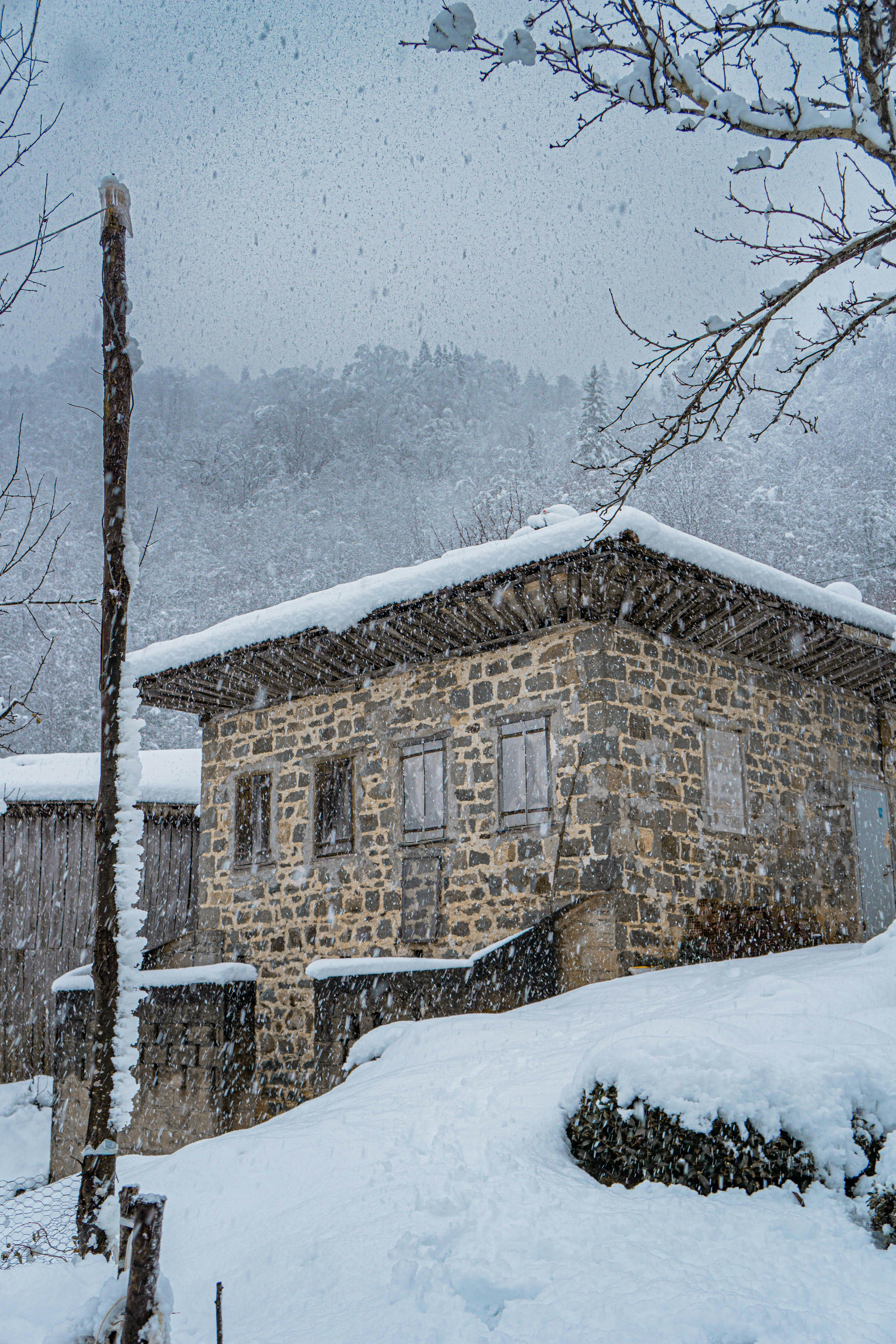 Snowy Stone House in Winter Landscape · Free Stock Photo