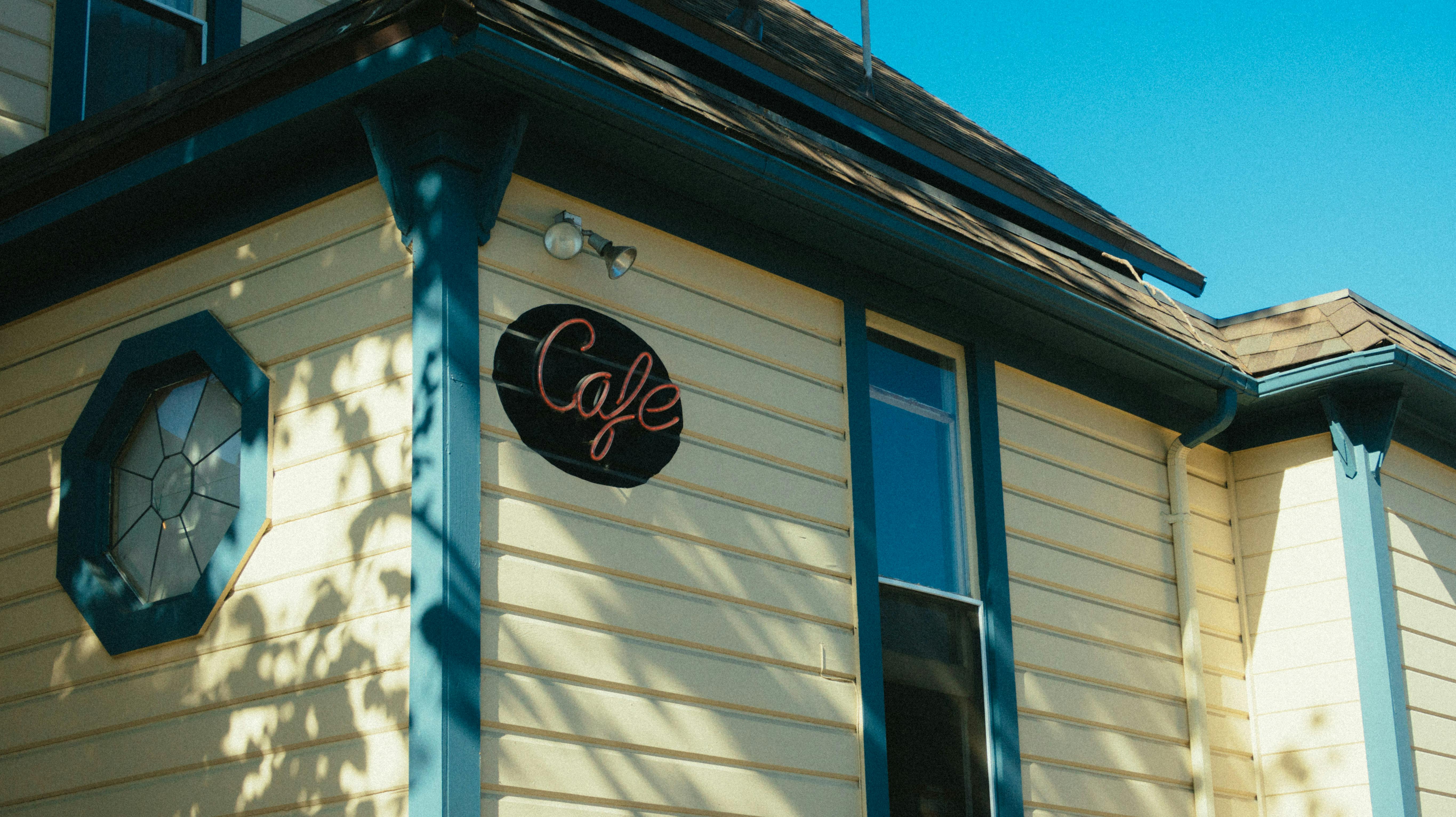 Cafe Signage on Wall · Free Stock Photo