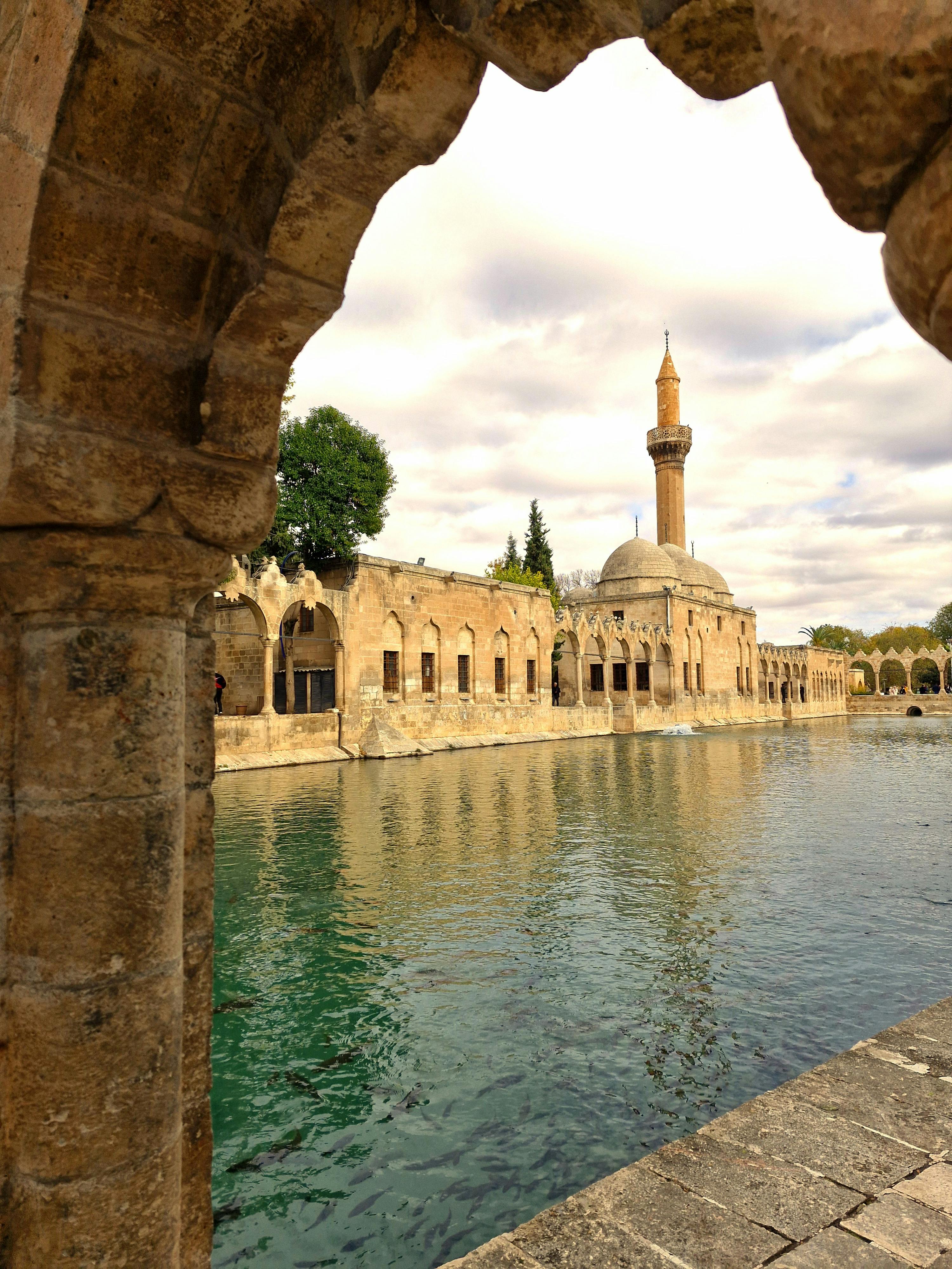 Scenic View of Historic Mosque over Water · Free Stock Photo