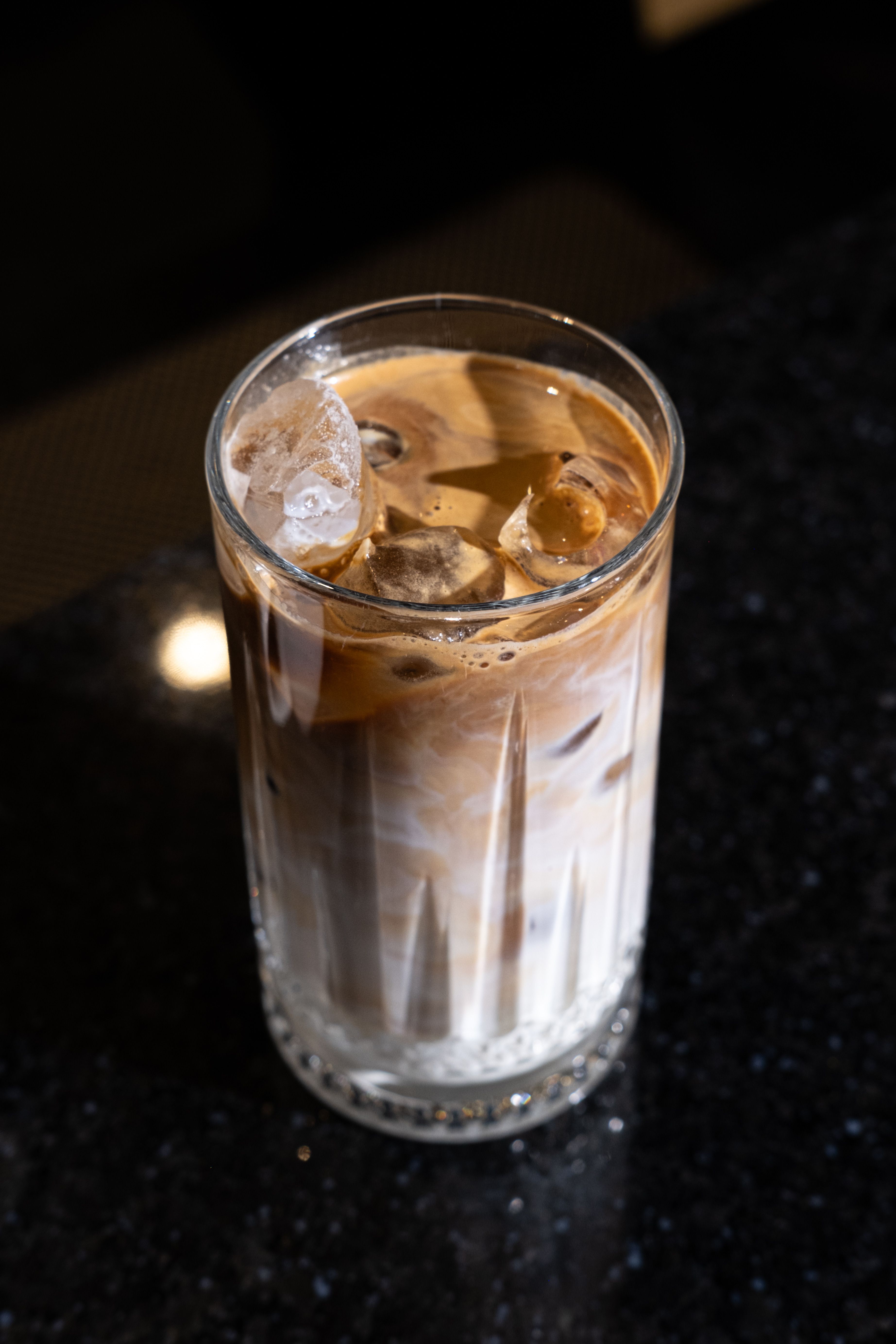 Refreshing Iced Coffee with Milk in Glass Cup · Free Stock Photo