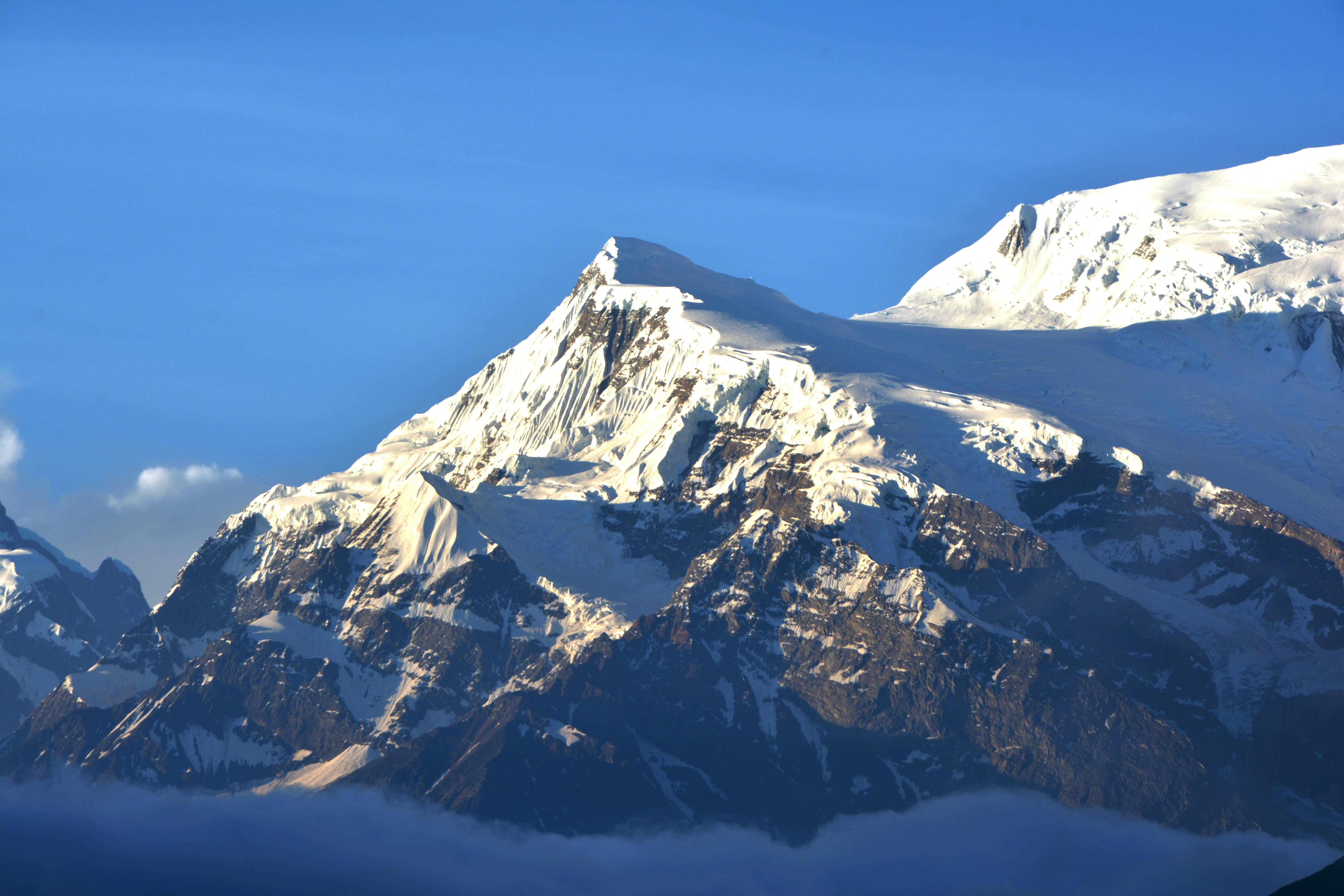 Snow-Capped Himalayan Peaks at Sunrise · Free Stock Photo