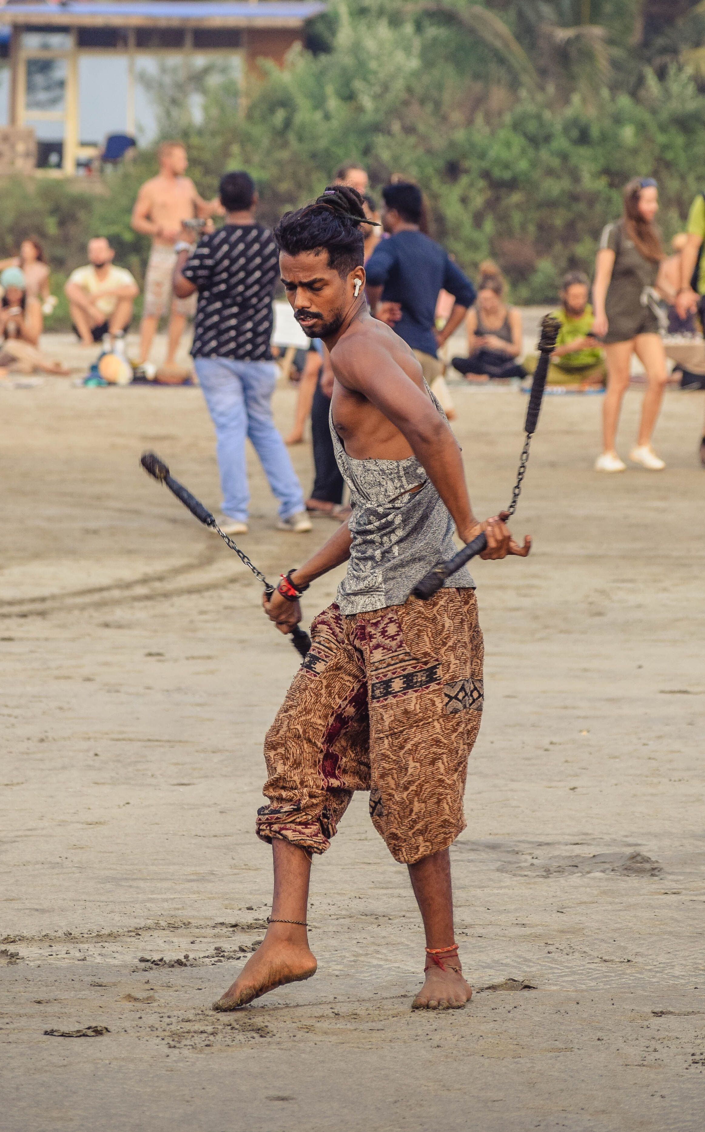 Street Performer Entertaining Crowd on Arambol Beach · Free Stock Photo
