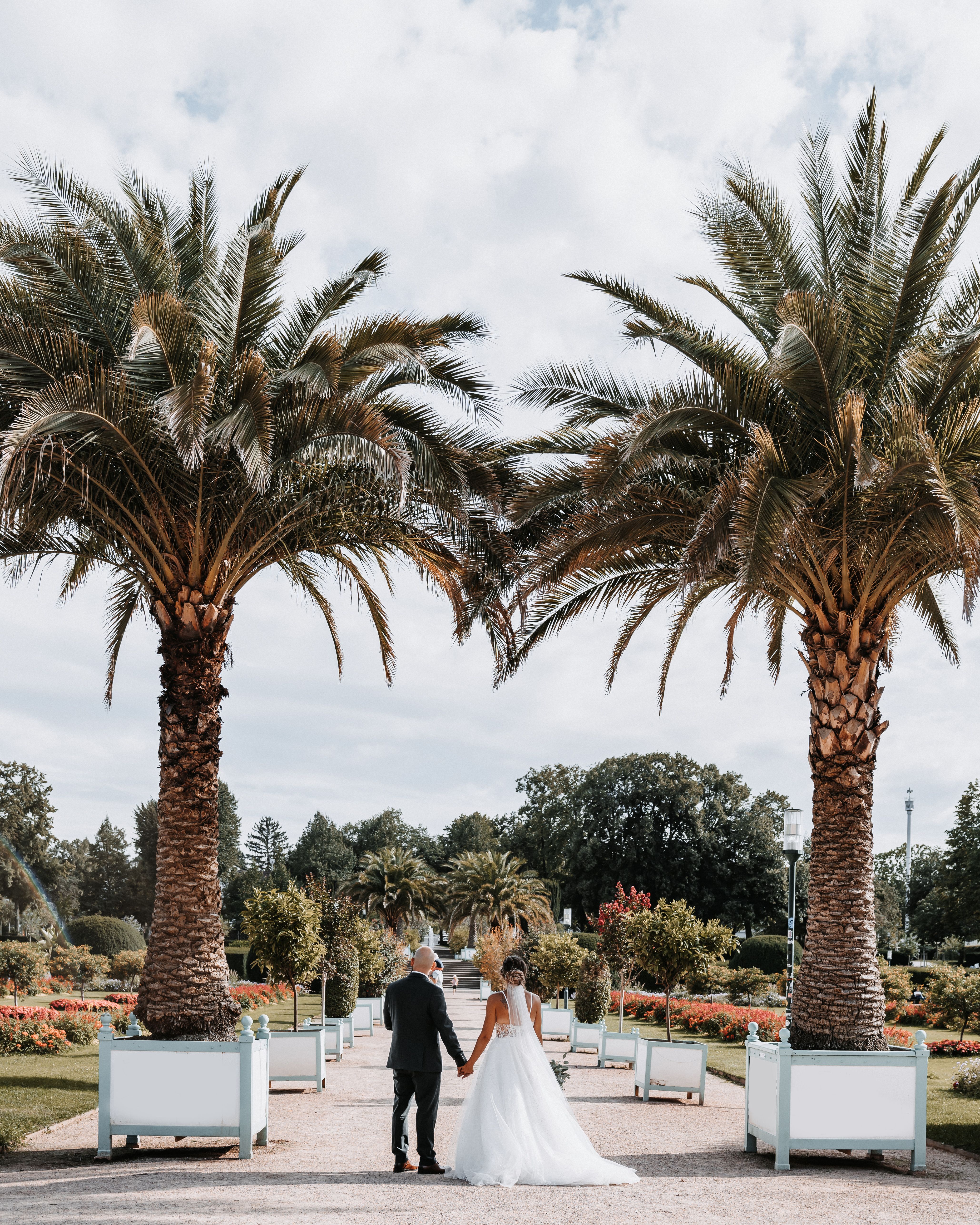 Romantic Wedding Couple in Garden Pathway · Free Stock Photo