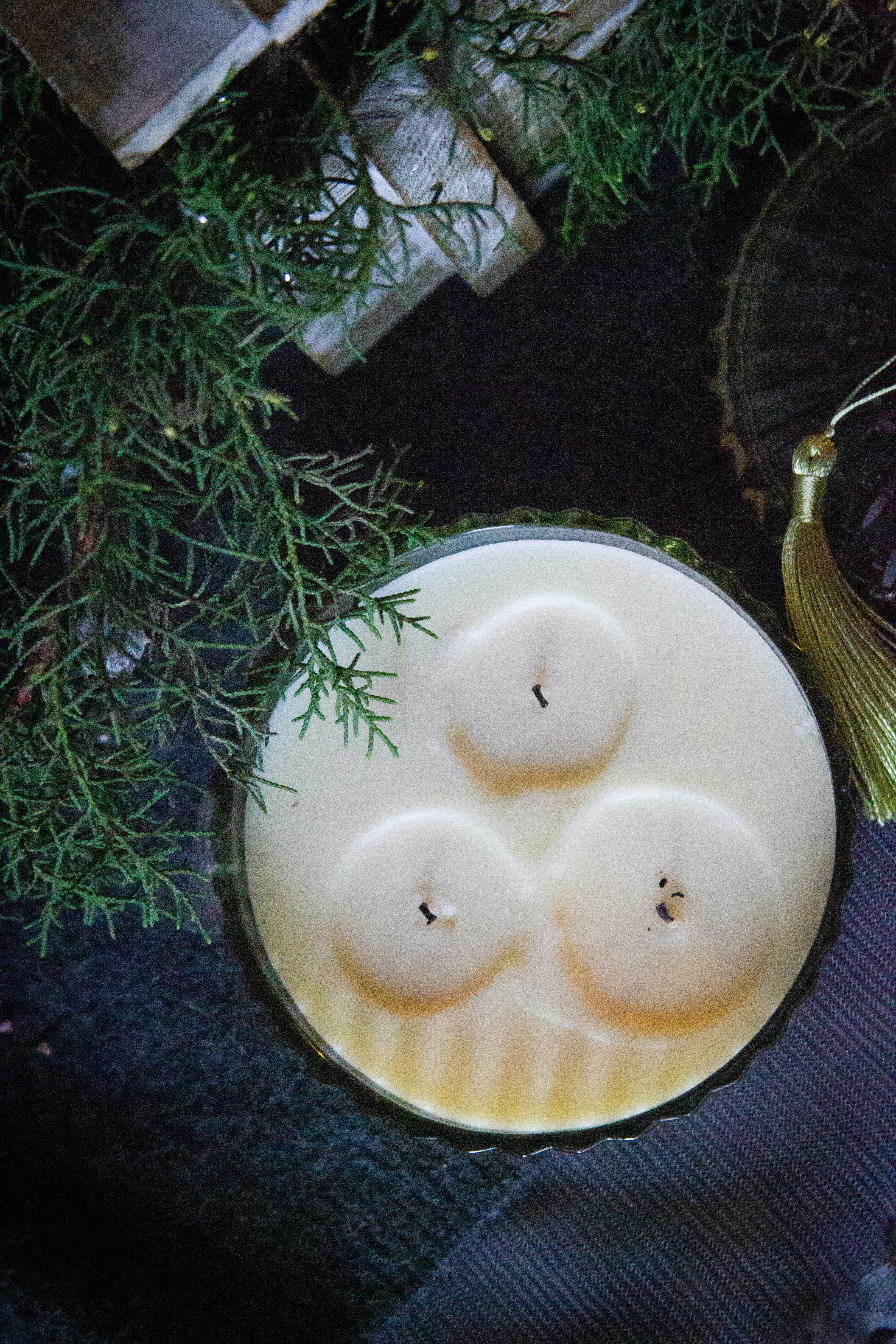 Overhead View of Three-Wick Candle with Greenery · Free Stock Photo