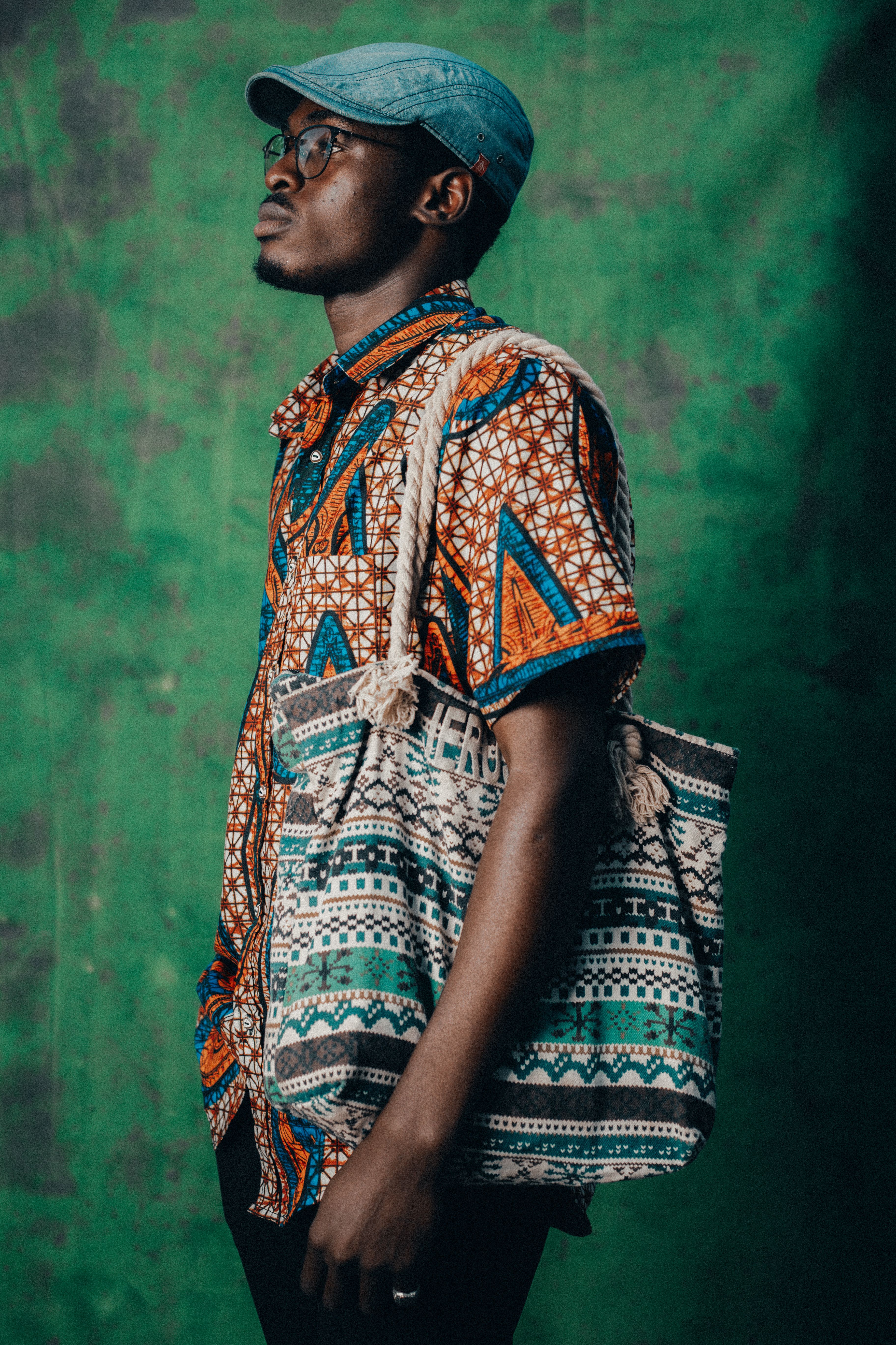 Stylish Man with Patterned Shirt and Bag · Free Stock Photo