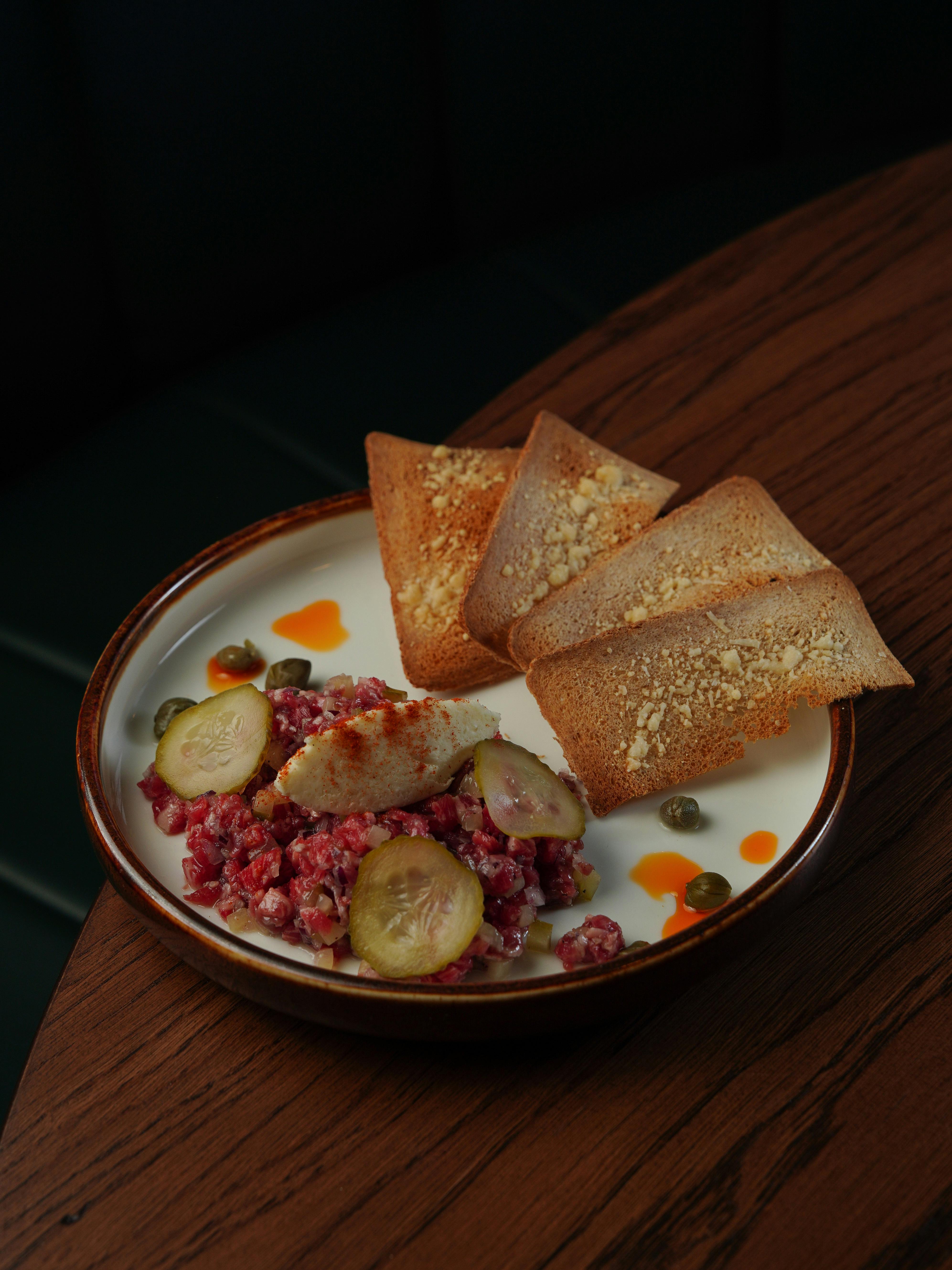 Gourmet Beef Tartare with Toasted Bread Slices · Free Stock Photo