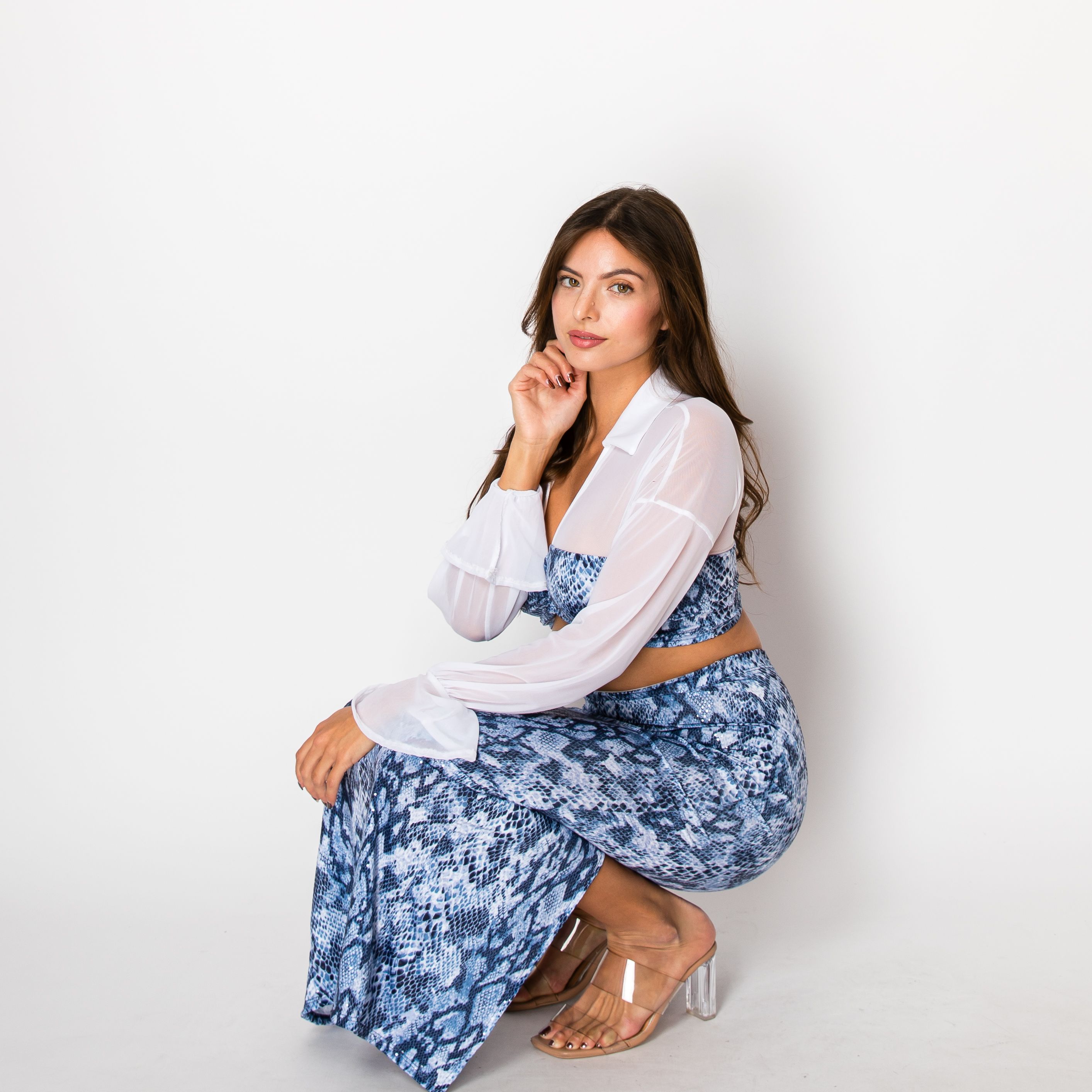 Elegant Woman Posing in Blue Patterned Outfit · Free Stock Photo