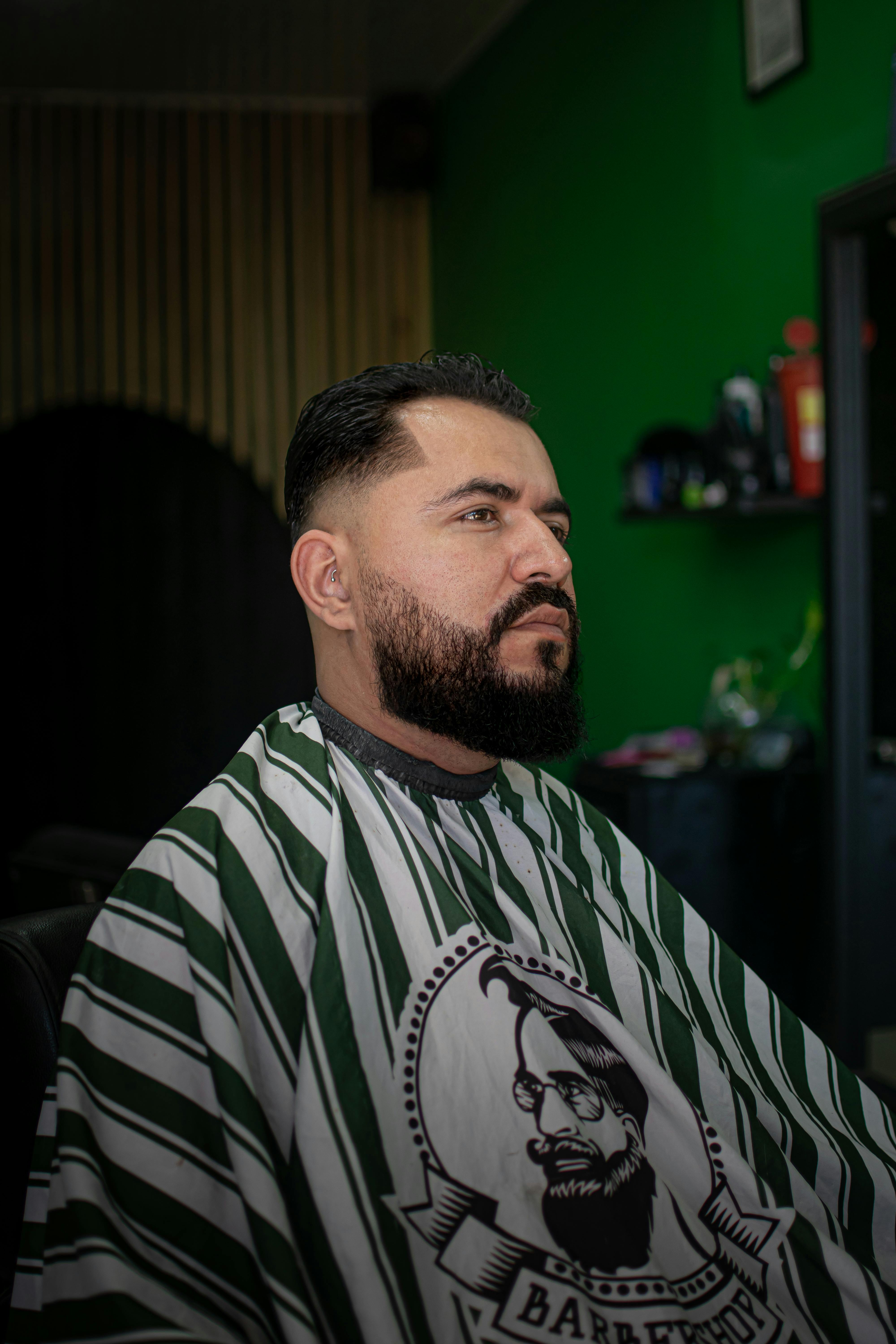 Man with Beard in Barbershop Portrait · Free Stock Photo