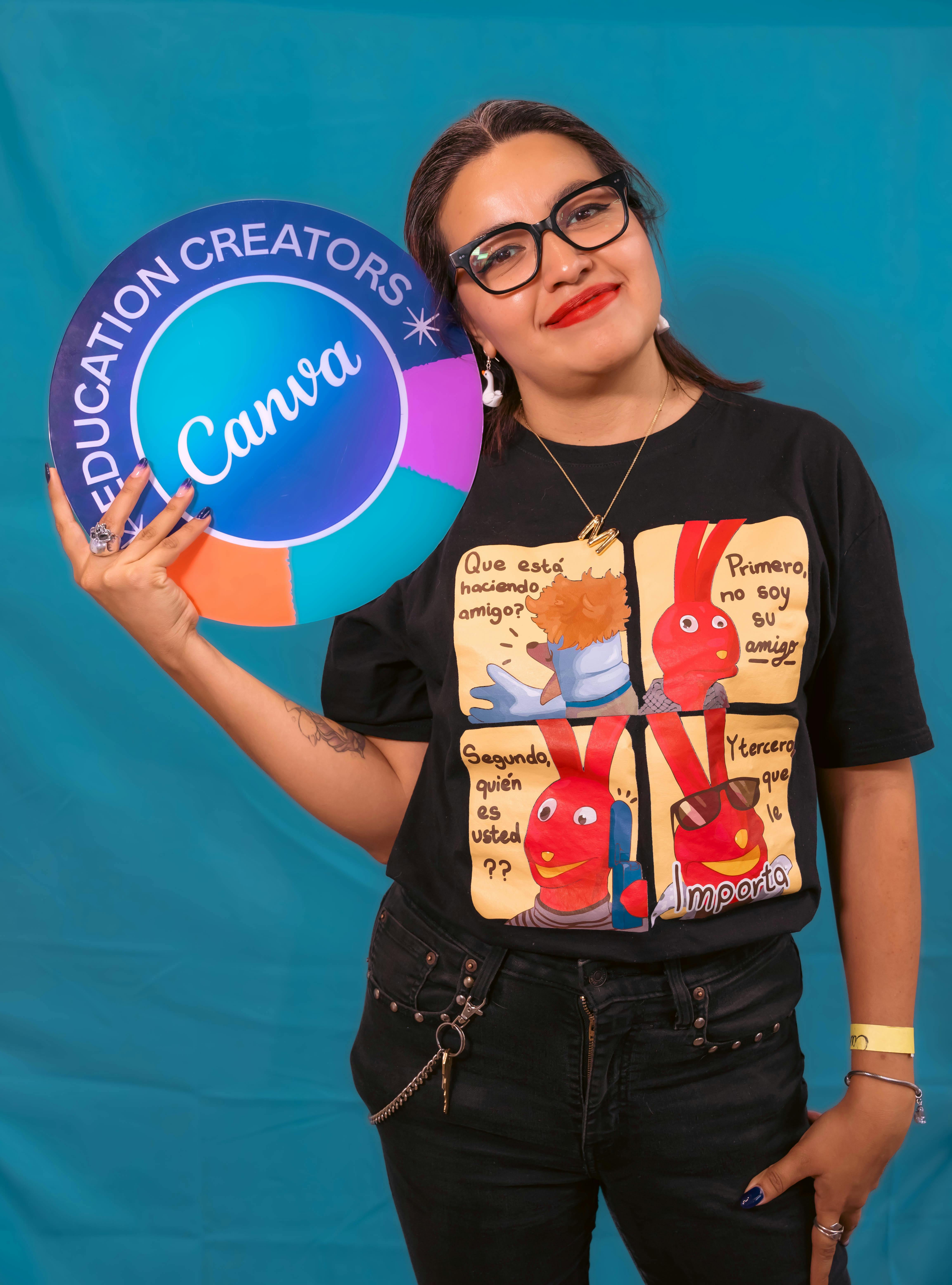 Young Woman Holding Canva Education Sign · Free Stock Photo