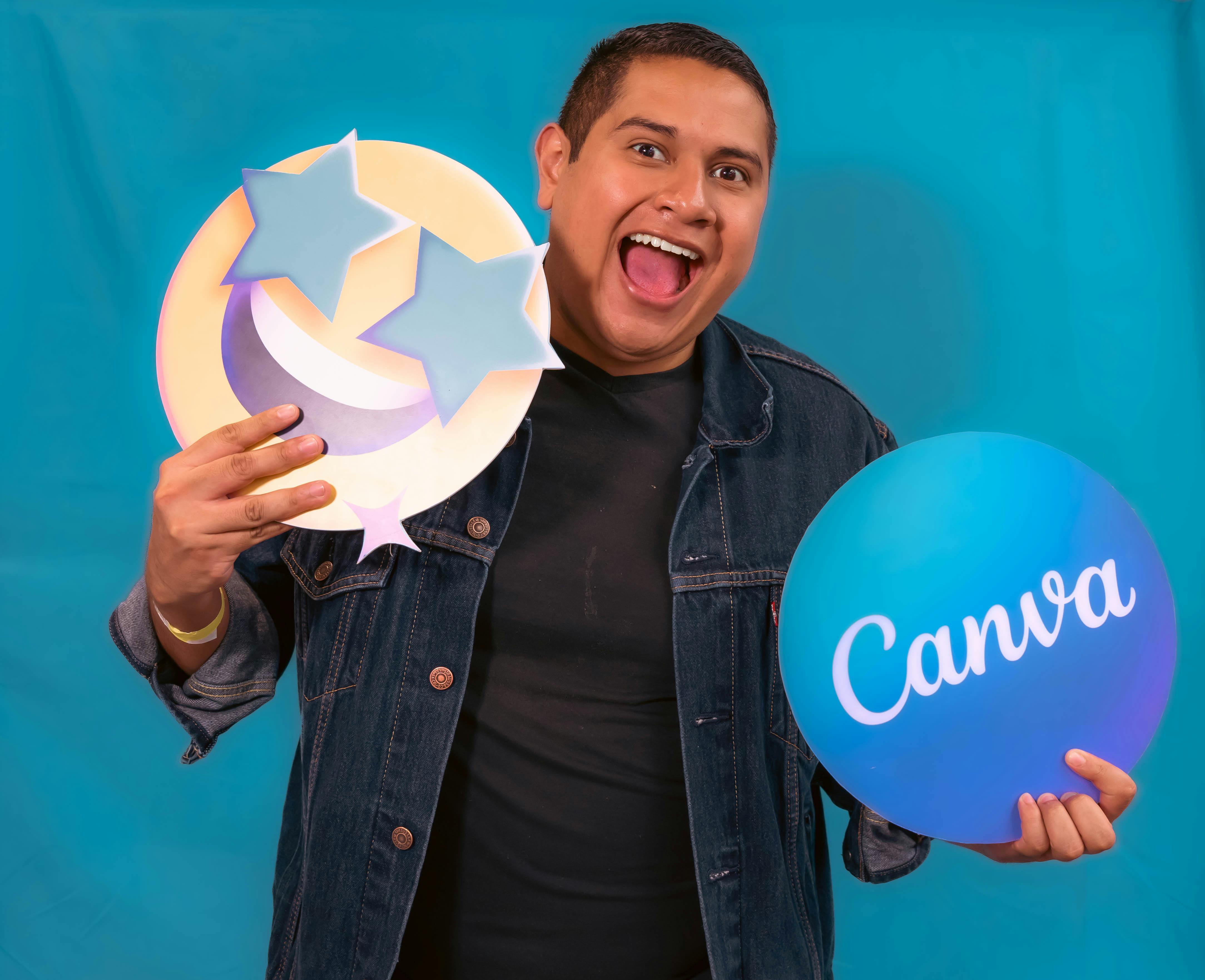 Cheerful Person Holding Canva and Star Symbols · Free Stock Photo