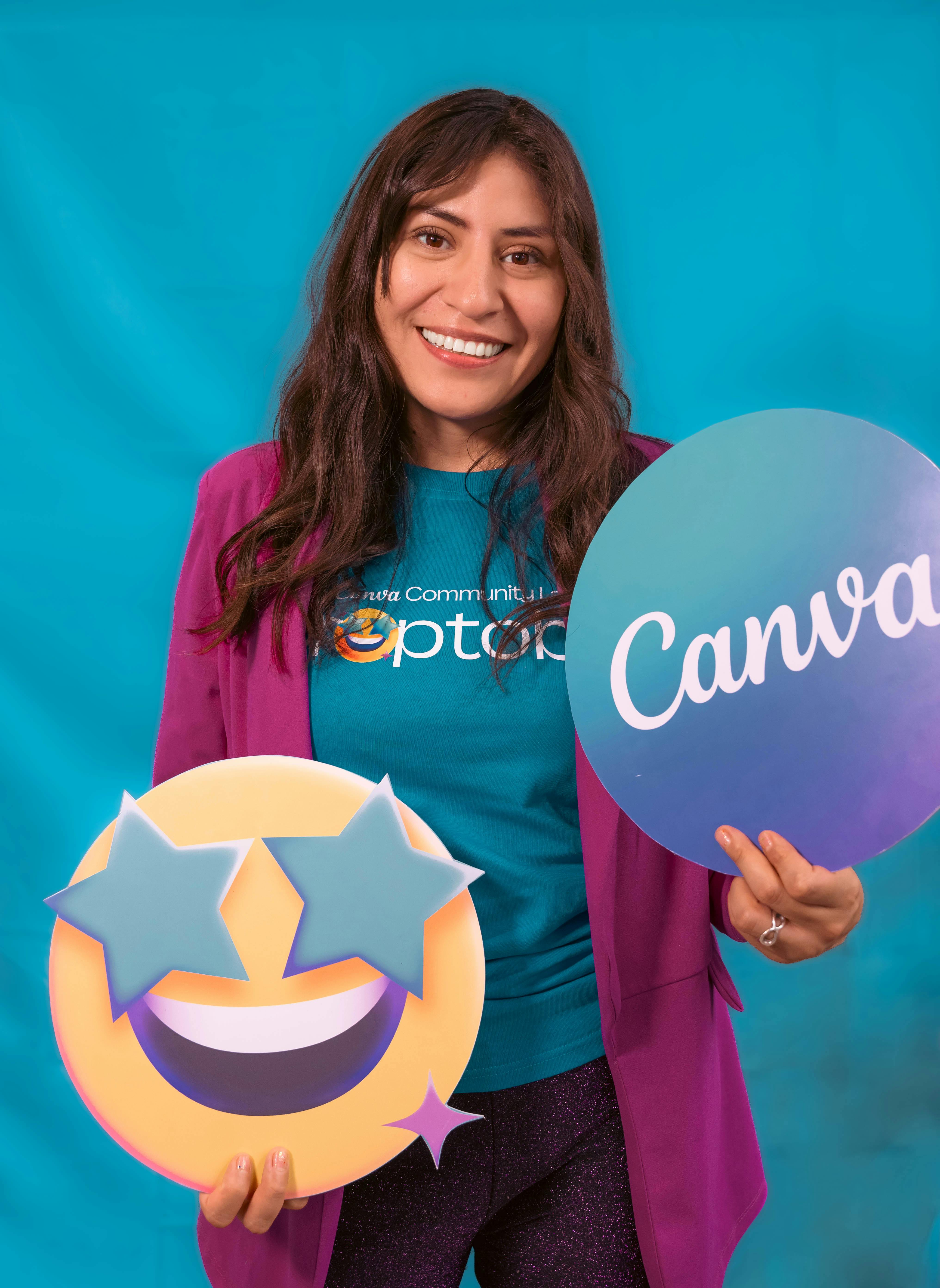 Smiling Woman Holding Emoji and Canva Signs · Free Stock Photo