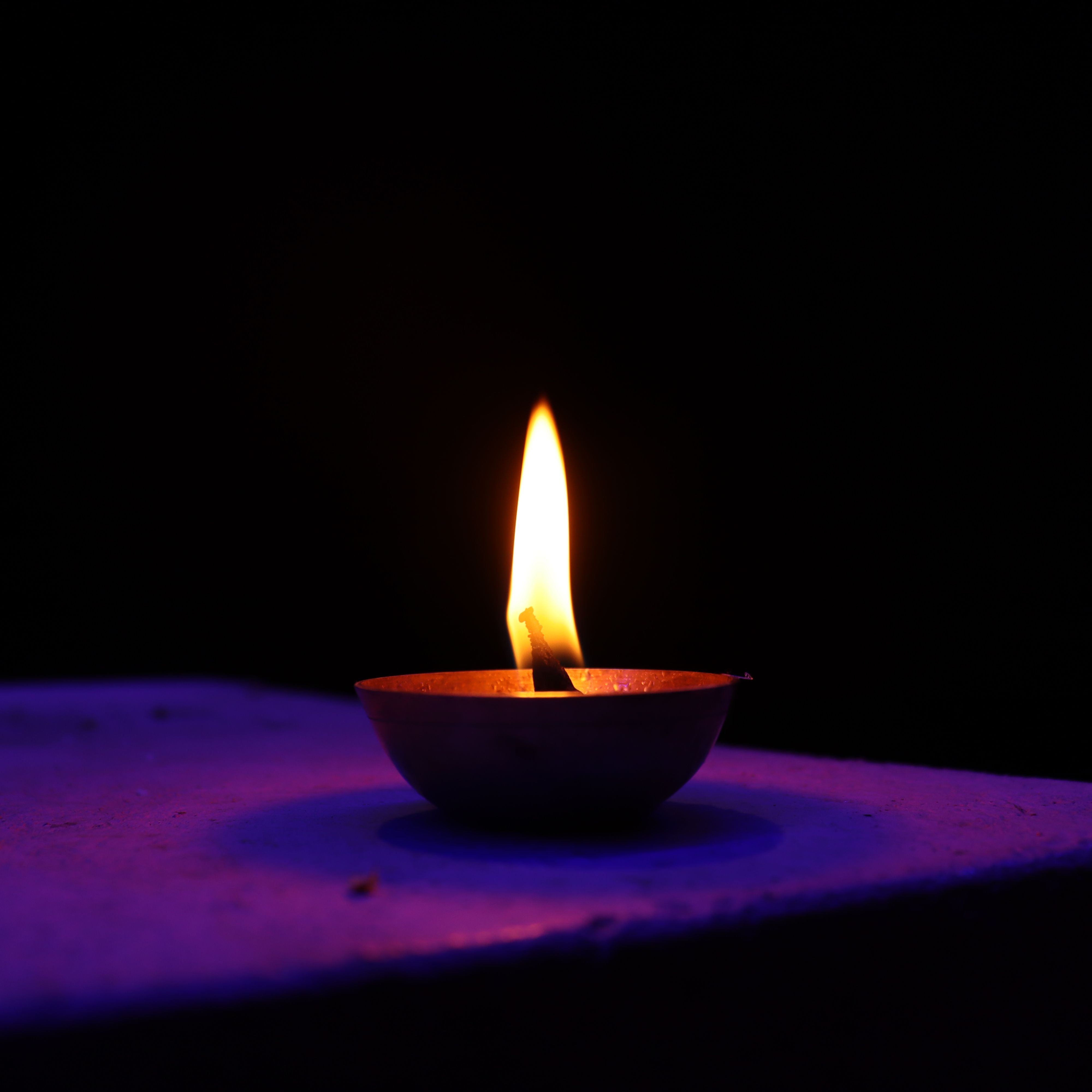 Diwali Lamp with Glowing Flame on Dark Background · Free Stock Photo