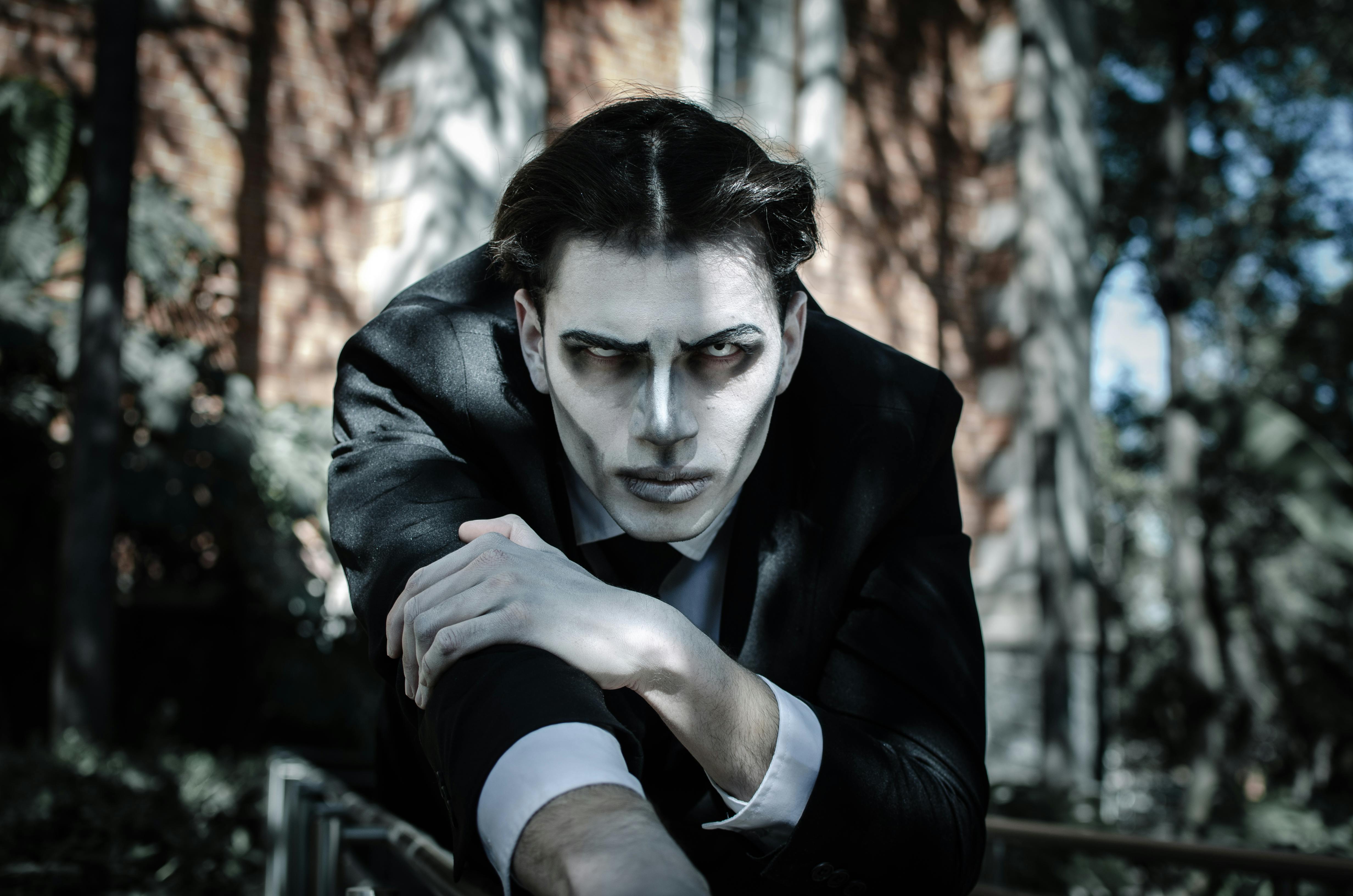 Mysterious Pale Figure in Black Suit Outdoors · Free Stock Photo