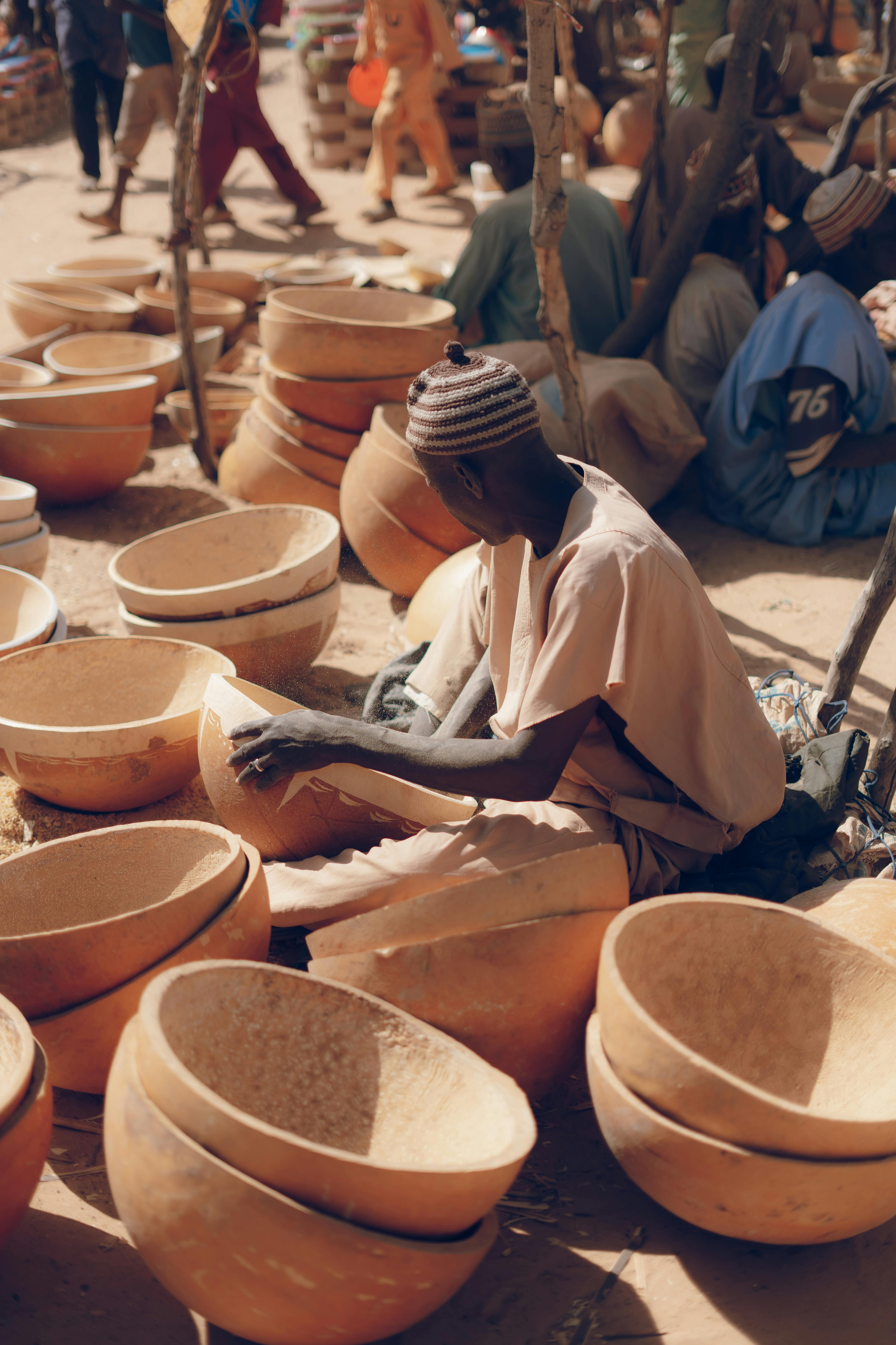 African Artisan Crafting Traditional Bowls in Nigerian Market · Free ...