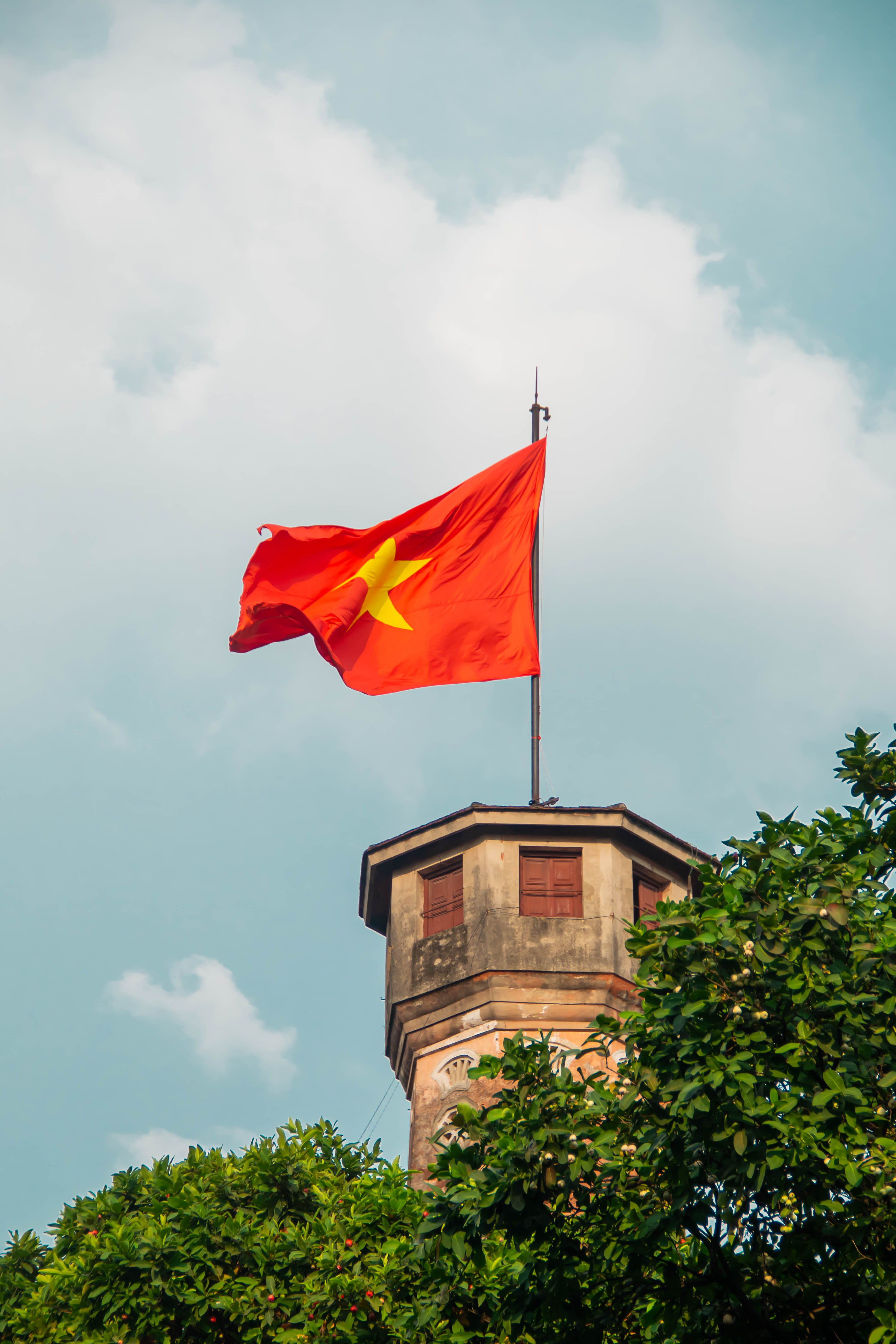 Vietnamese Flag on Hanoi Flag Tower in Blue Sky · Free Stock Photo
