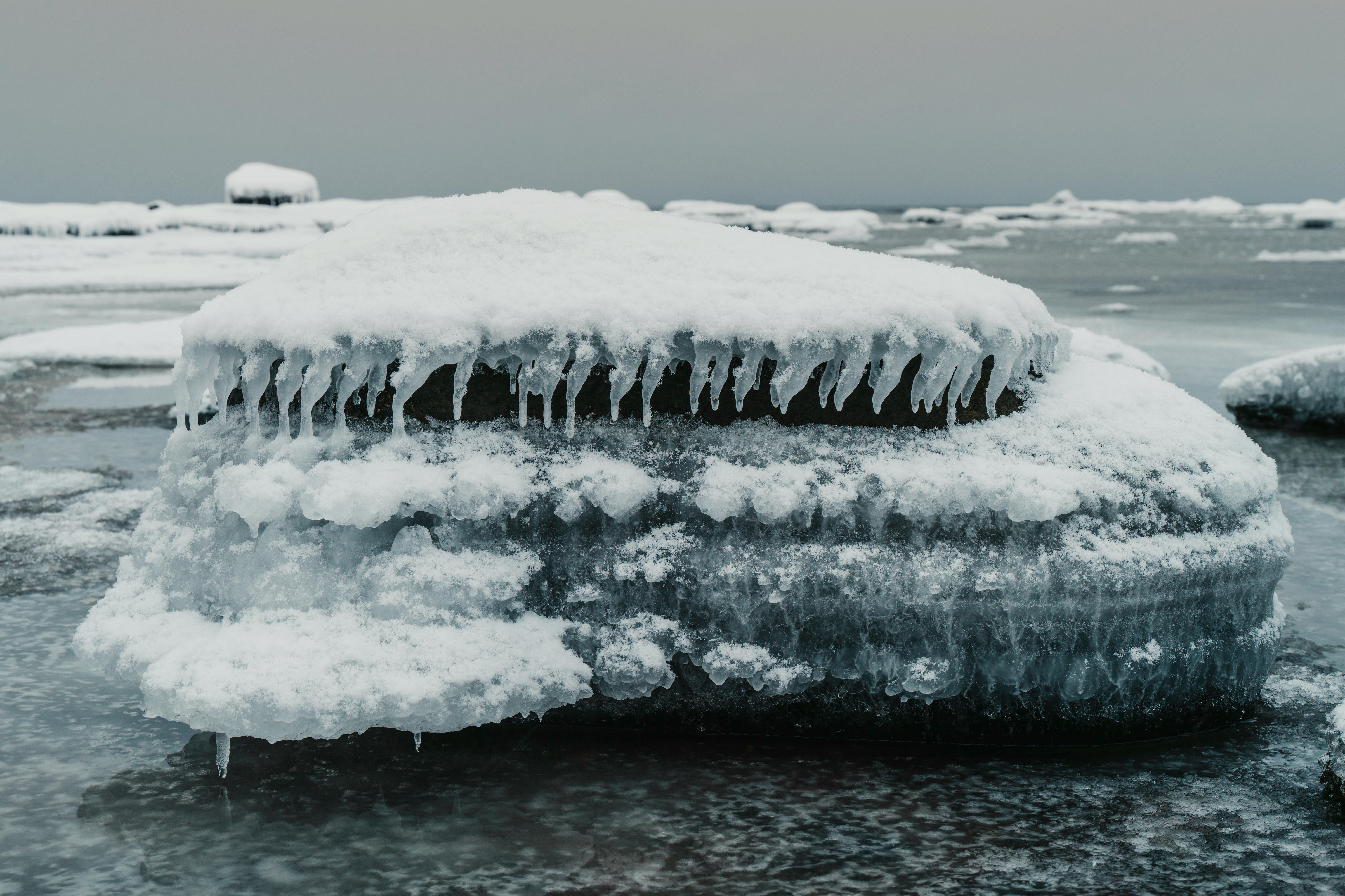 Frozen Landscape with Ice-Covered Rocks in Winter · Free Stock Photo
