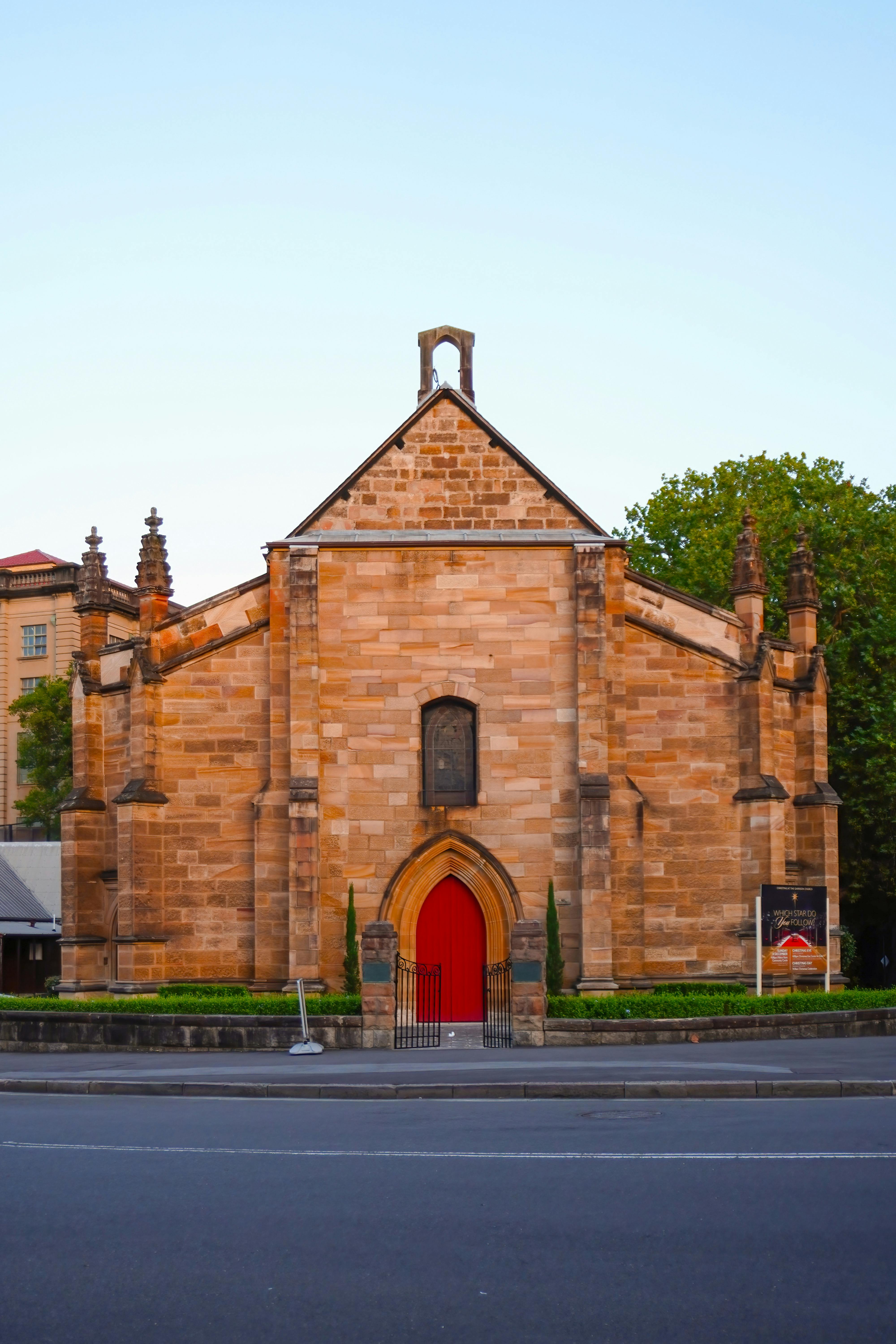 Historic Sandstone Church with Red Door · Free Stock Photo