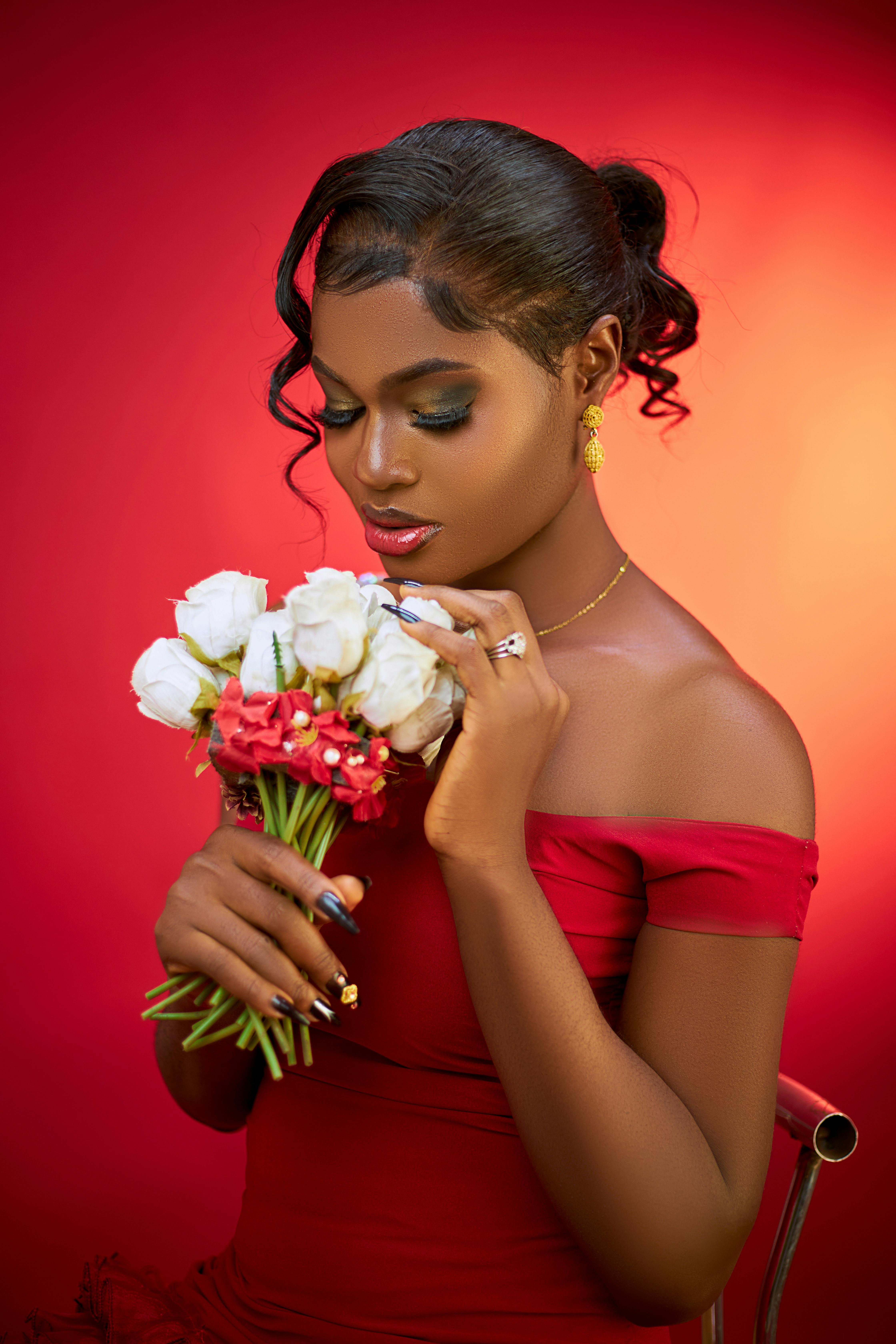 Elegant Portrait of Woman Holding Roses · Free Stock Photo