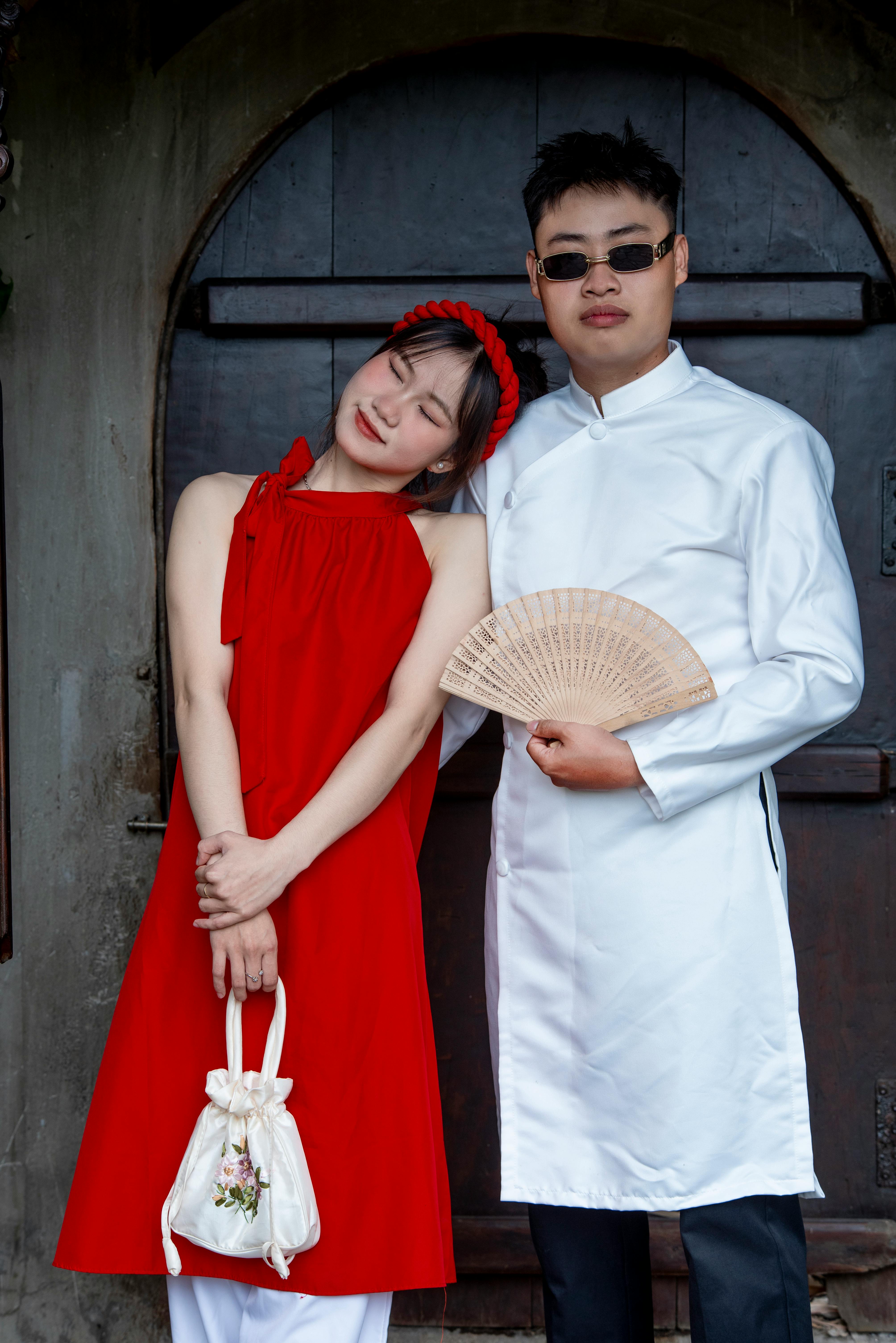 Elegant Couple in Traditional Asian Attire · Free Stock Photo