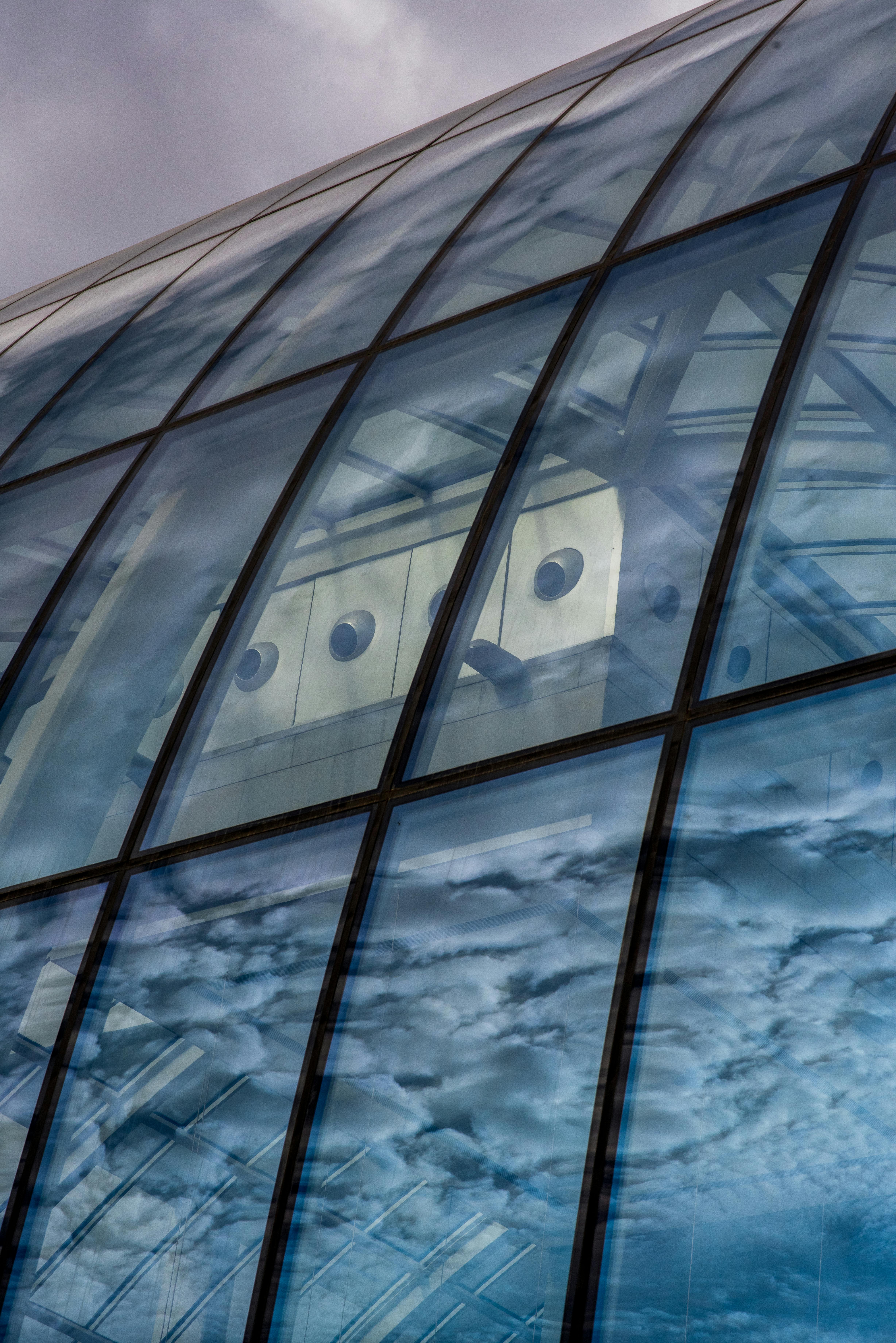 Modern Glass Dome Reflecting Cloudy Sky · Free Stock Photo